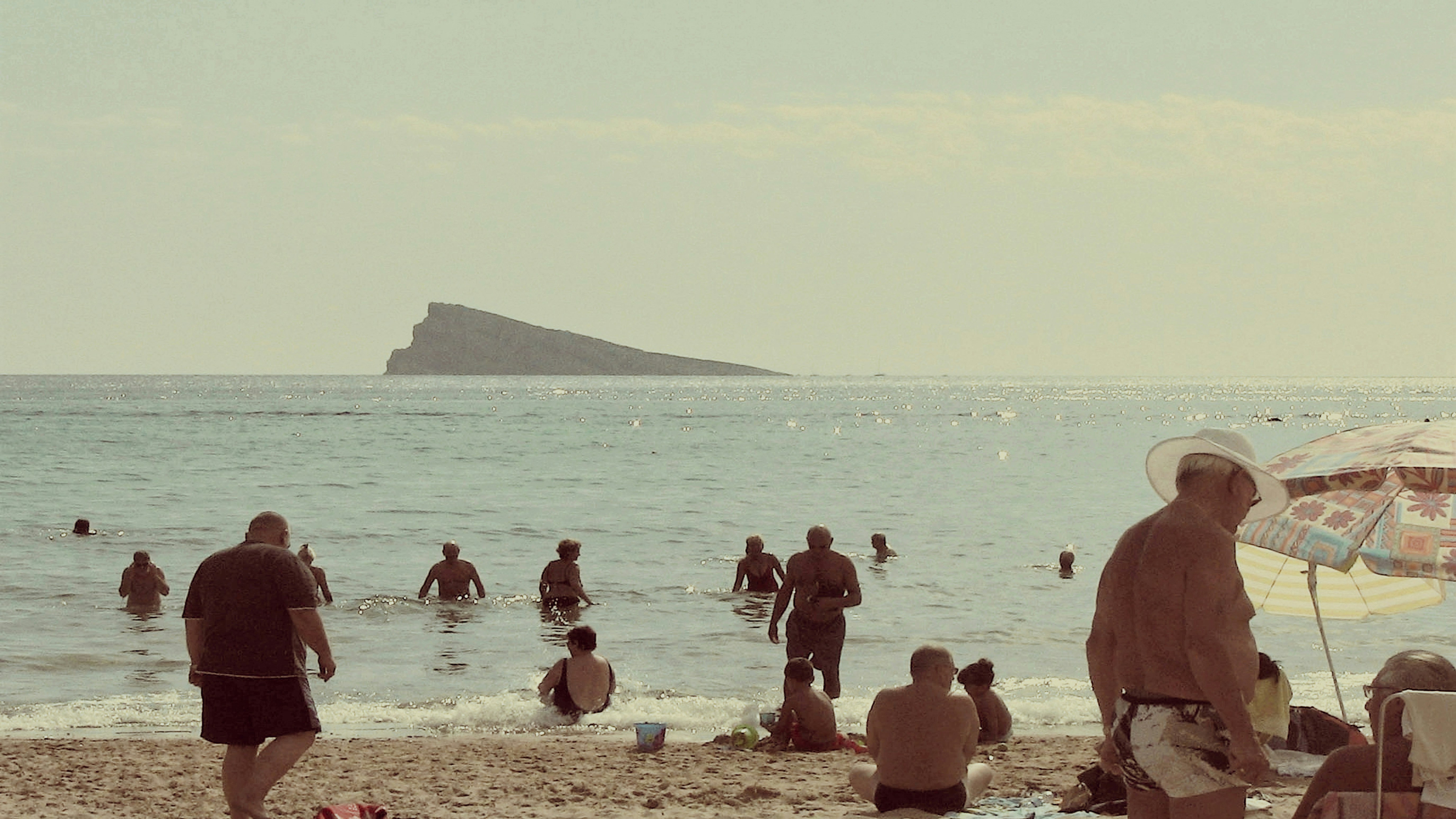 People enjoy the beach and sea on a sunny day. photo – Free Beach Image ...