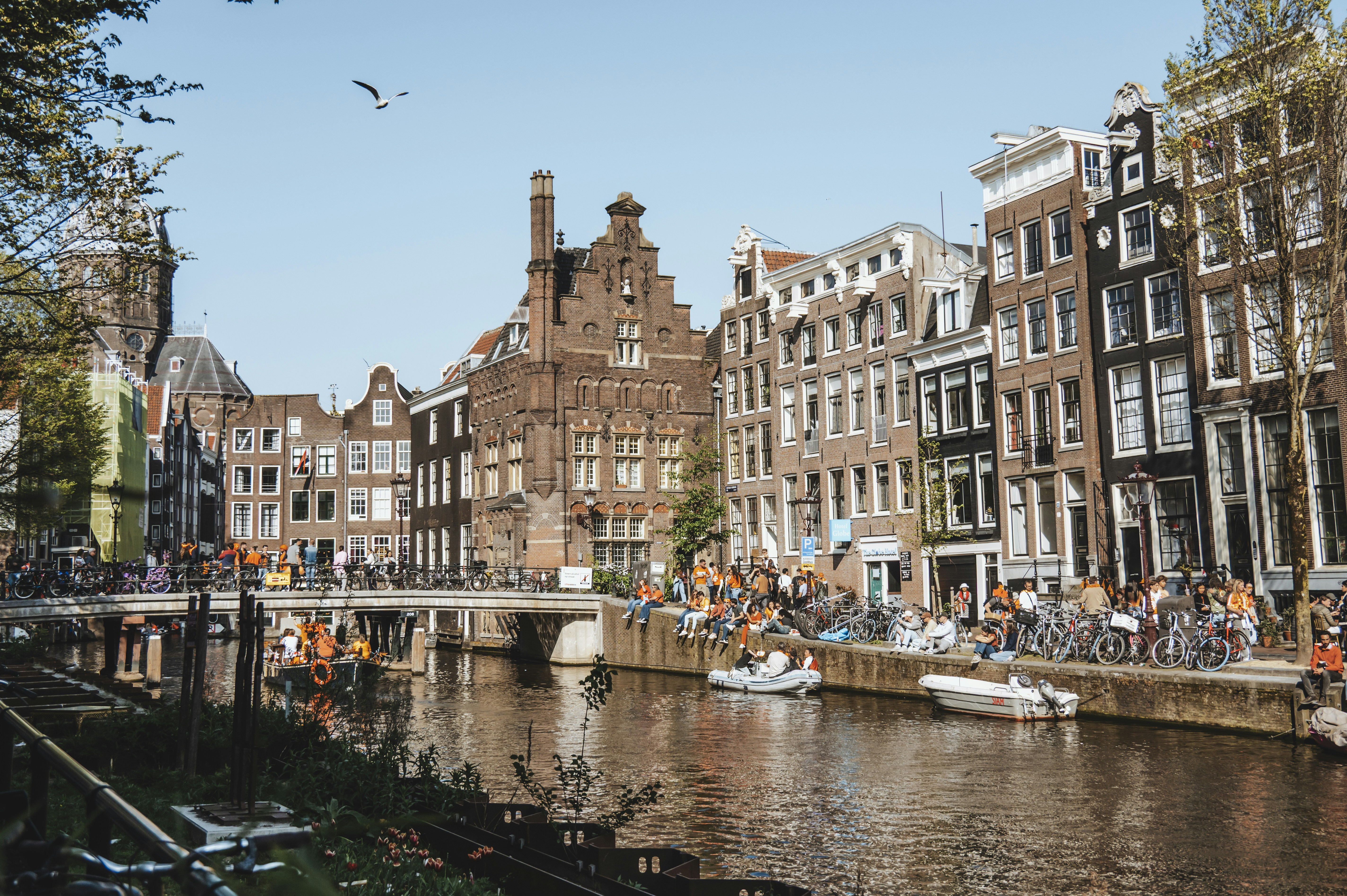 A beautiful canal in amsterdam with charming buildings.