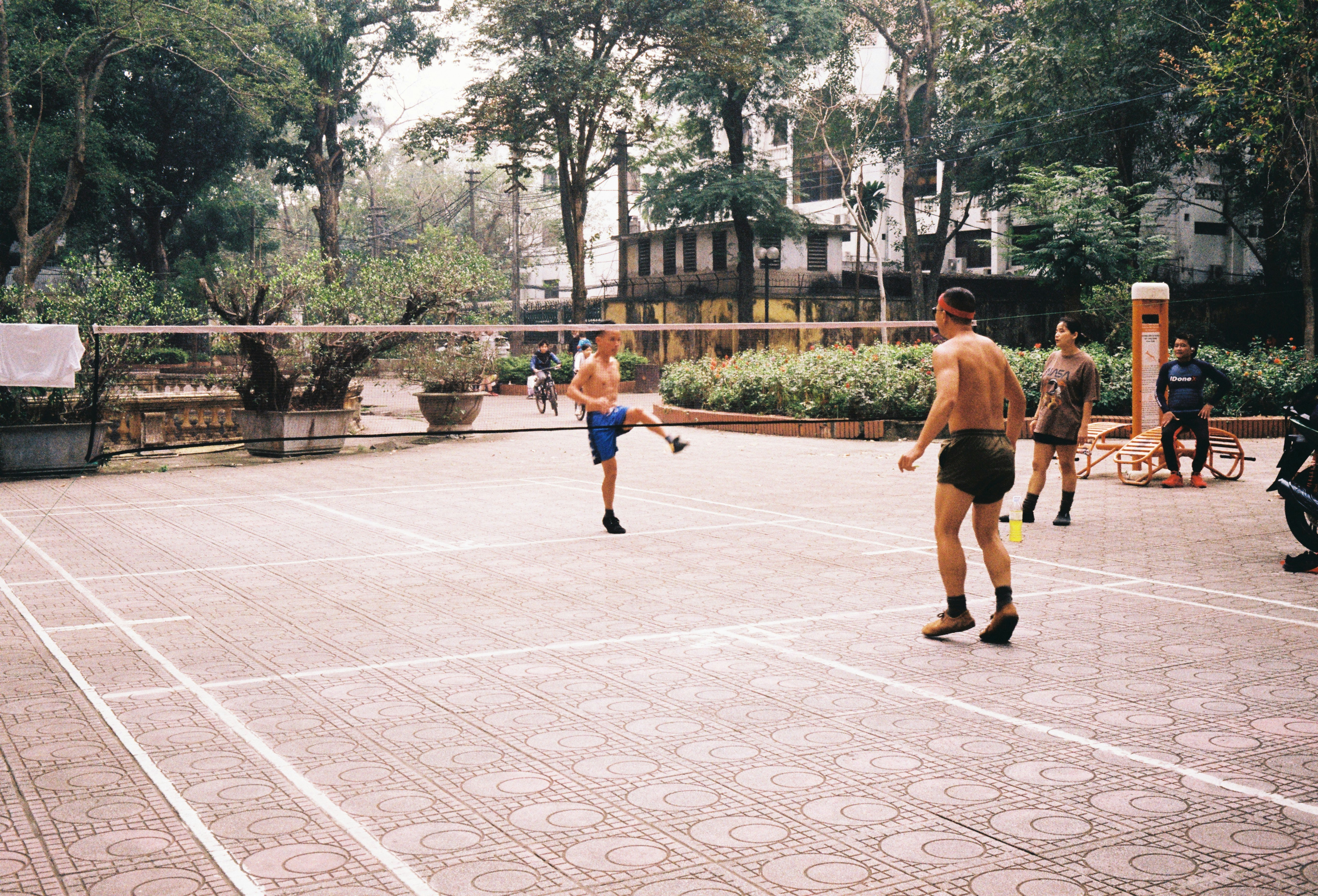 Men play foot-volleyball in an outdoor park. photo – Free Human Image ...