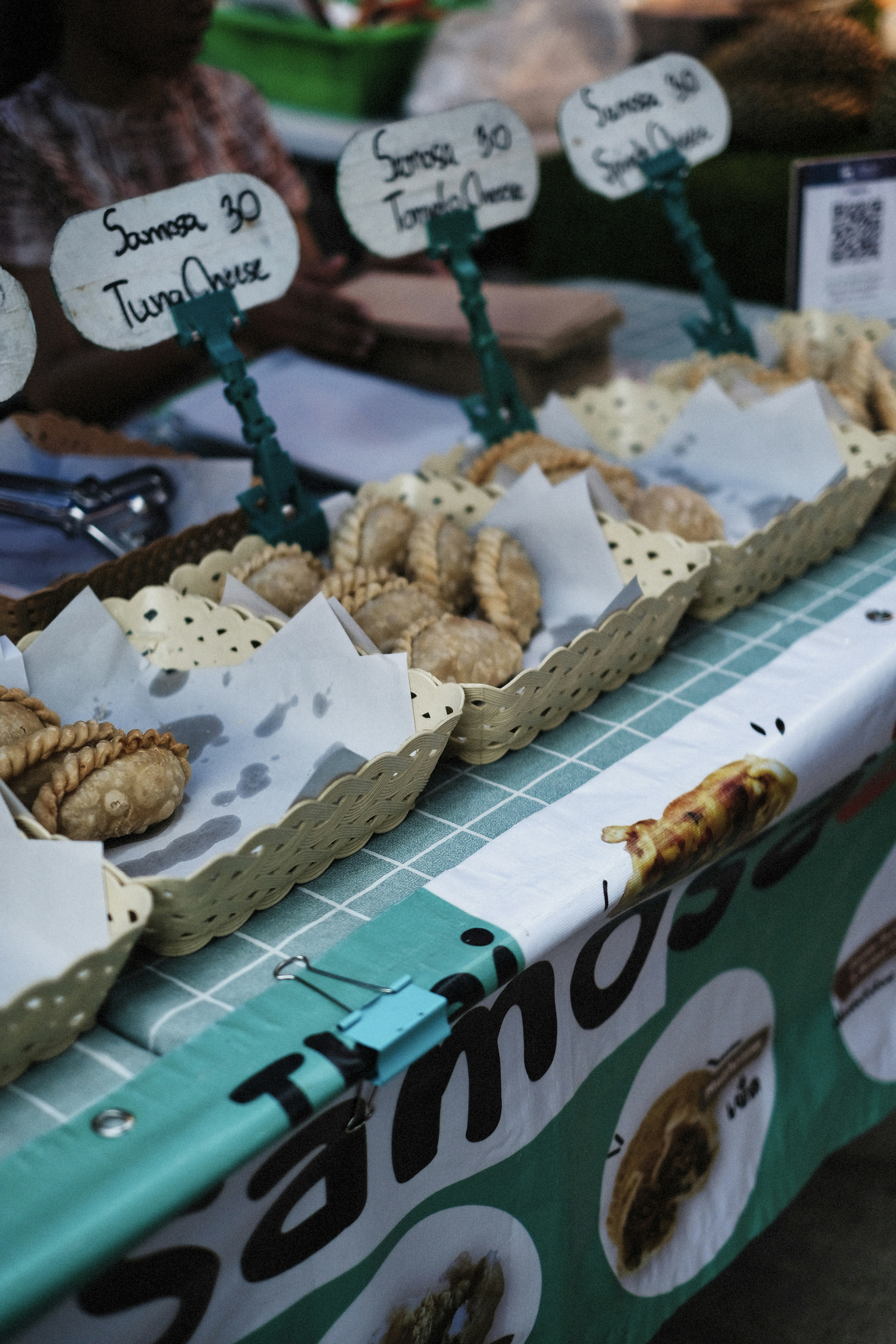 Baskets of Golden Pastries at a Sunlit Market Stall