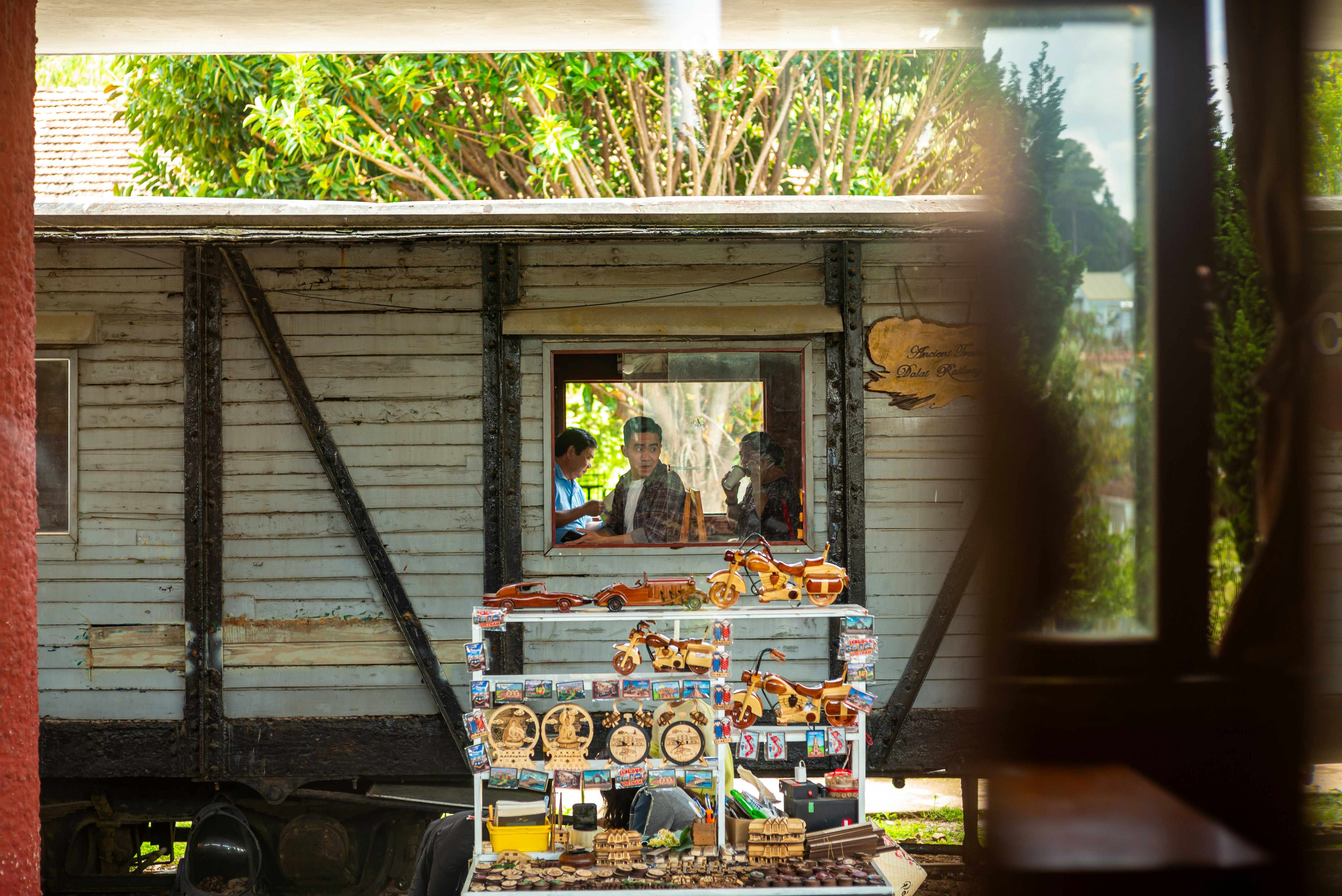 Windowed Encounter at a Weathered Train Car Market