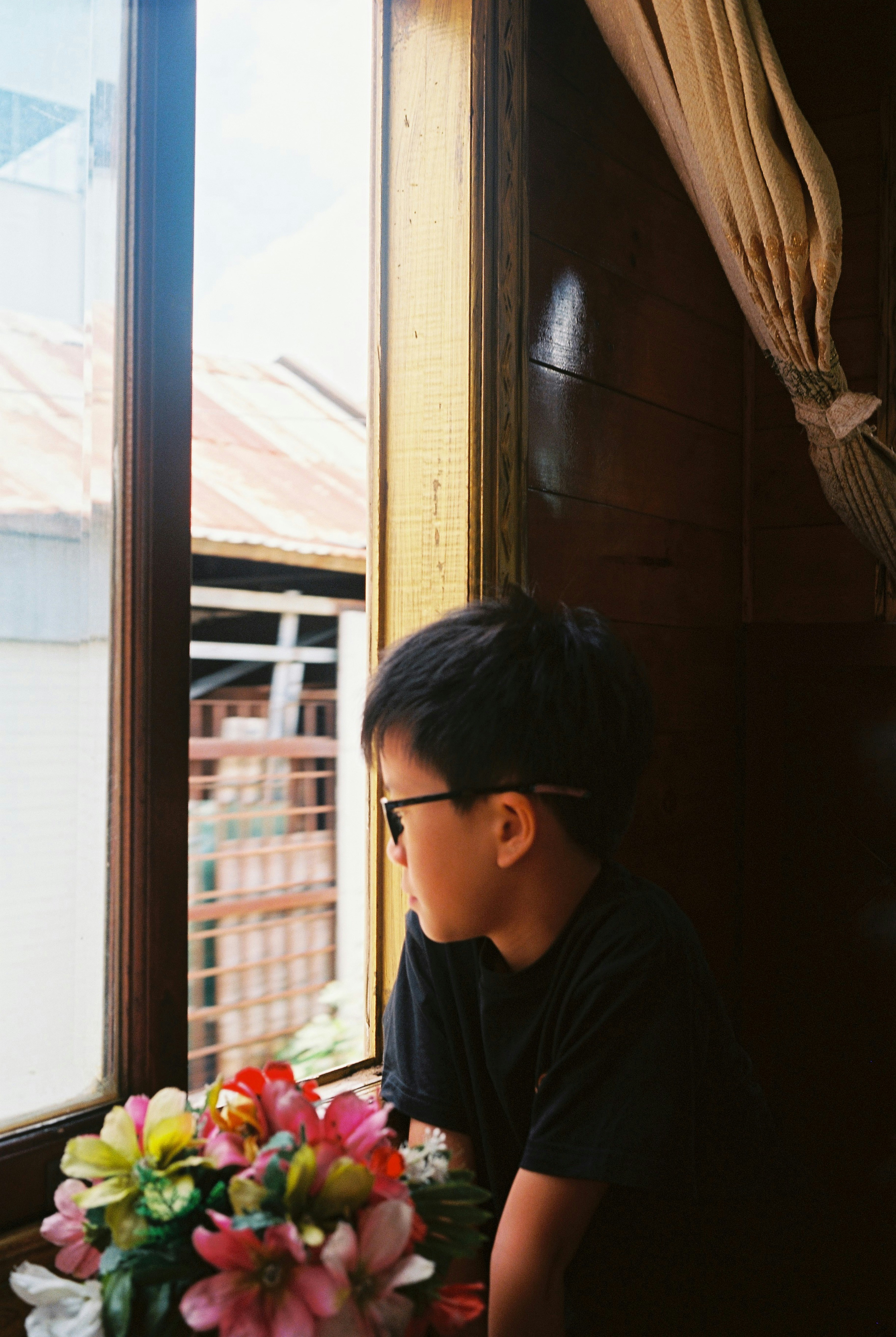 Reflections of Youth: A Quiet Moment by the Window