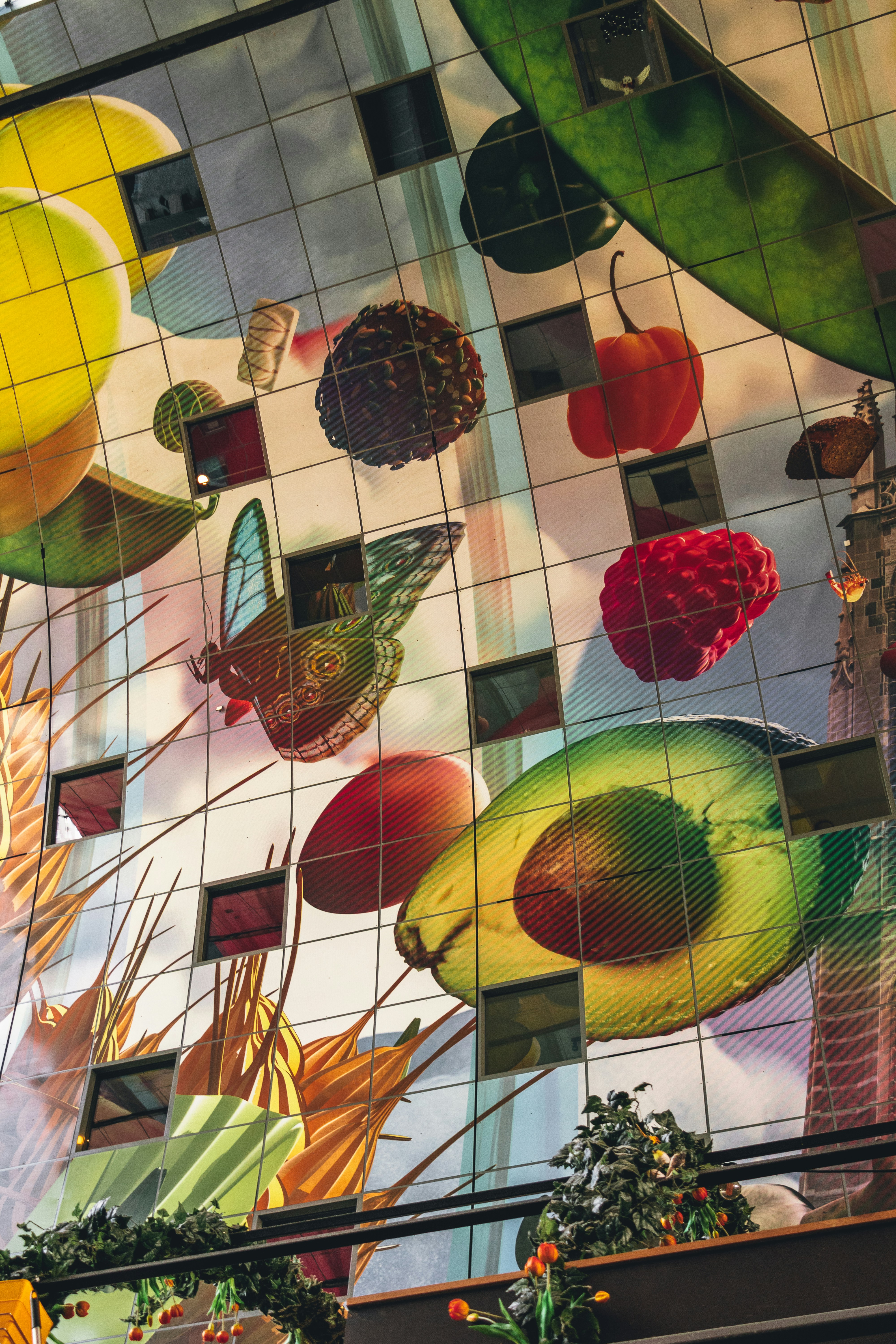 The beutiful roof graffiti art inside the Markthall food market in Rotterdam, Netherlands