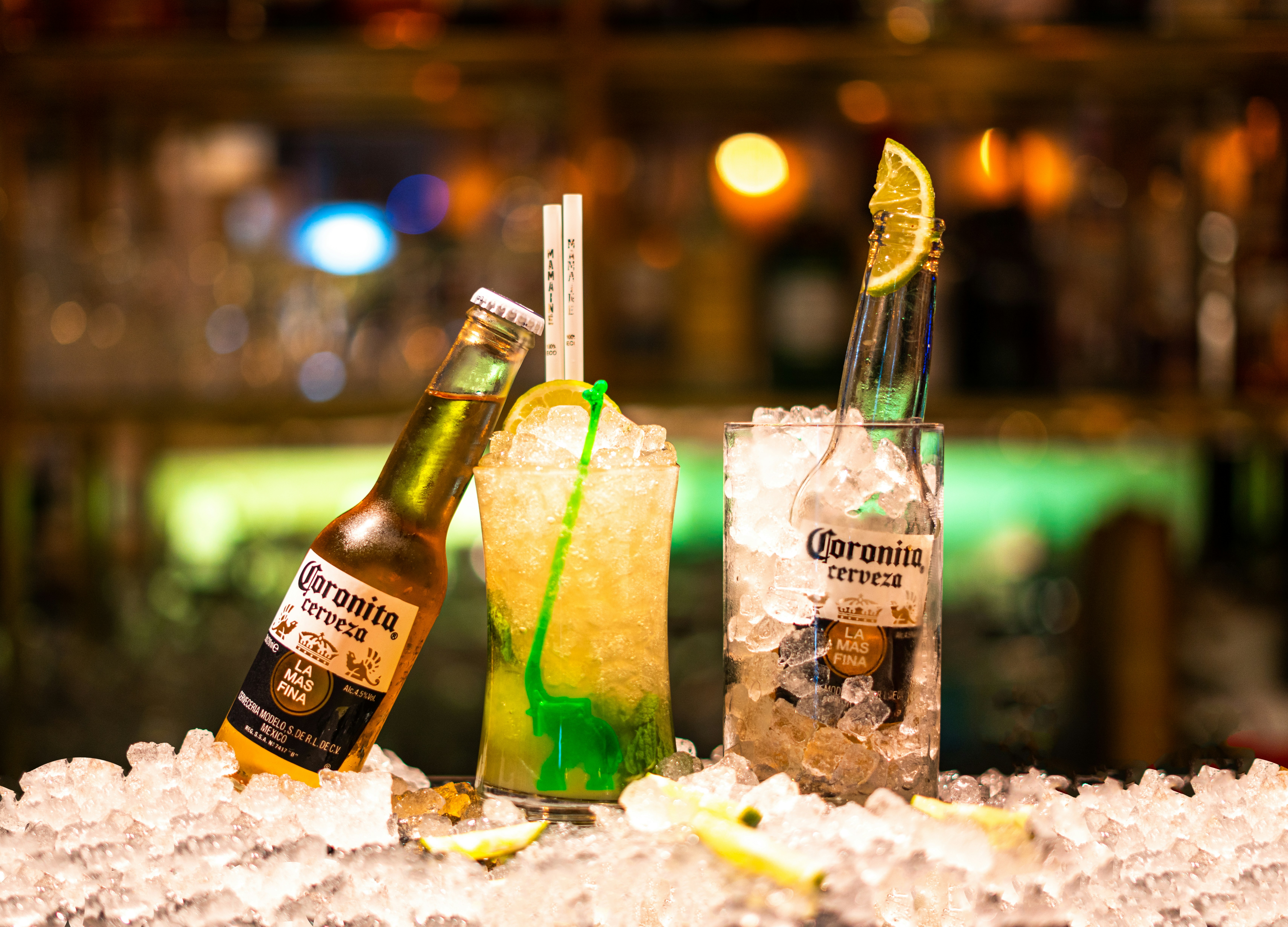 Mojito drink for MAMAINE Barcelona. | Corona beer bottles in ice with a cocktail.