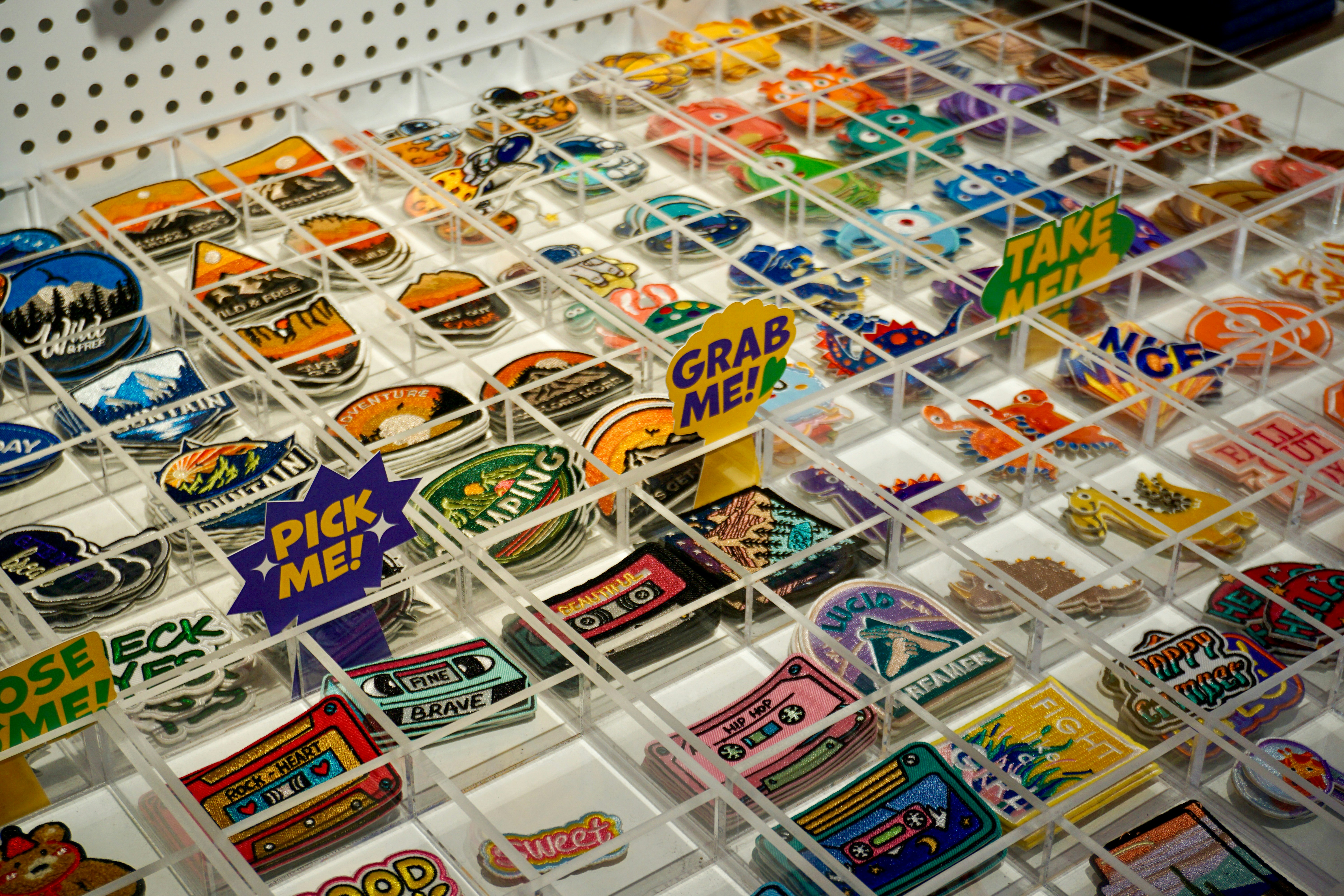 Colorful Capsule Tins in a Grid of Toy Labels