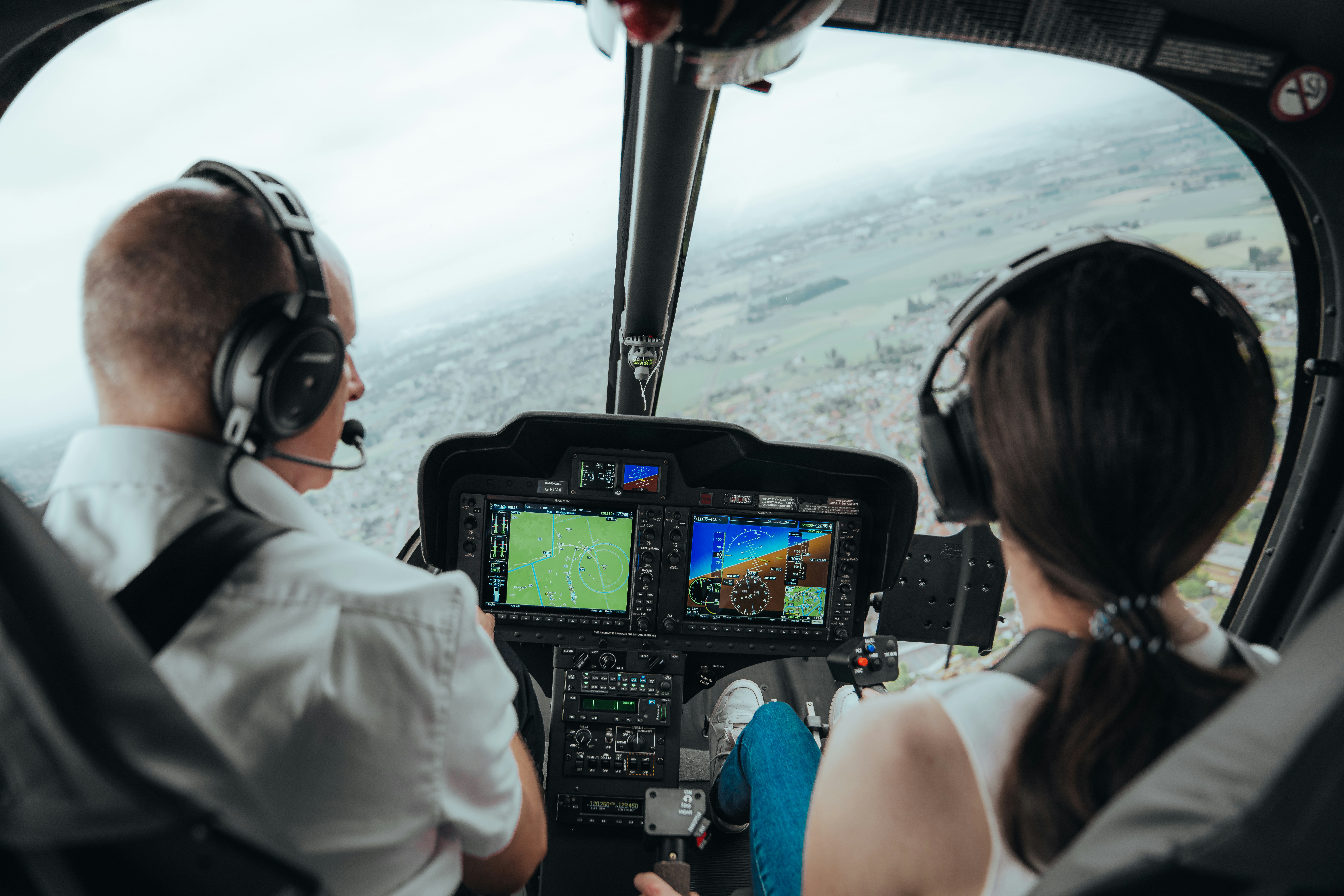 Two people fly a helicopter together. photo – Free Portrait Image on ...