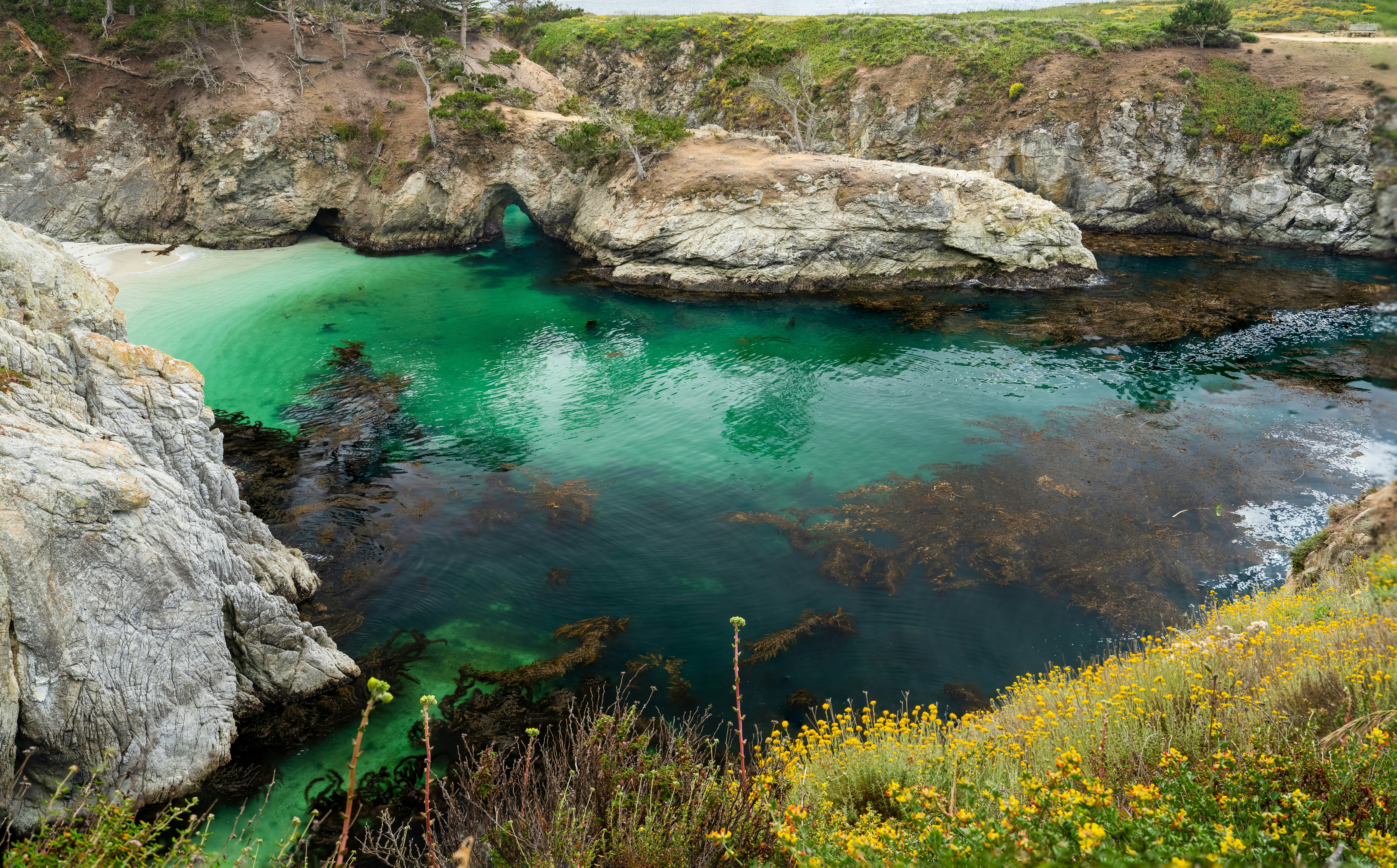 Verdigris Inlet: Turquoise Waters Between Craggy Cliffs