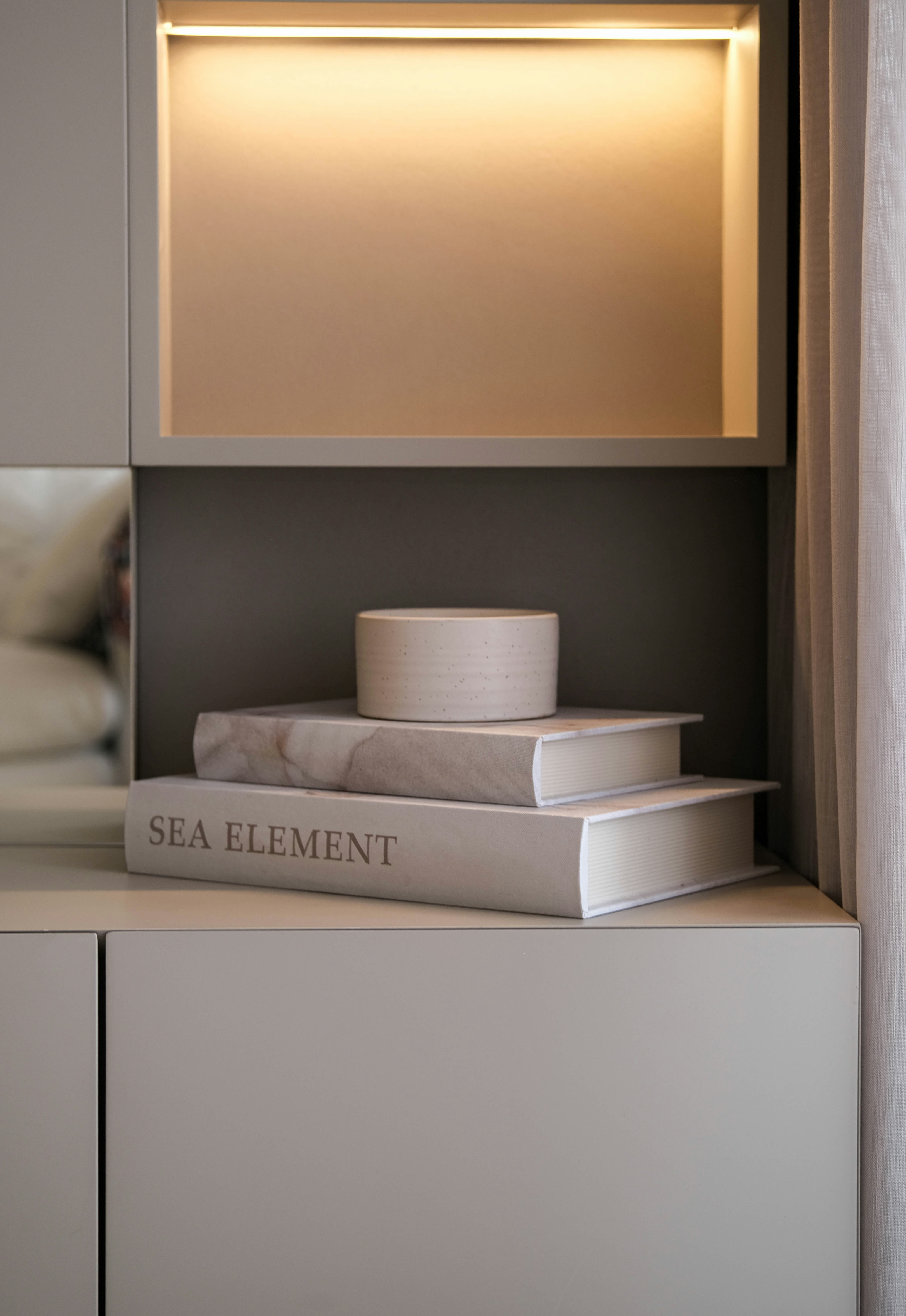 Books and a cylinder are in a stylish niche. photo – Free Texture Image ...