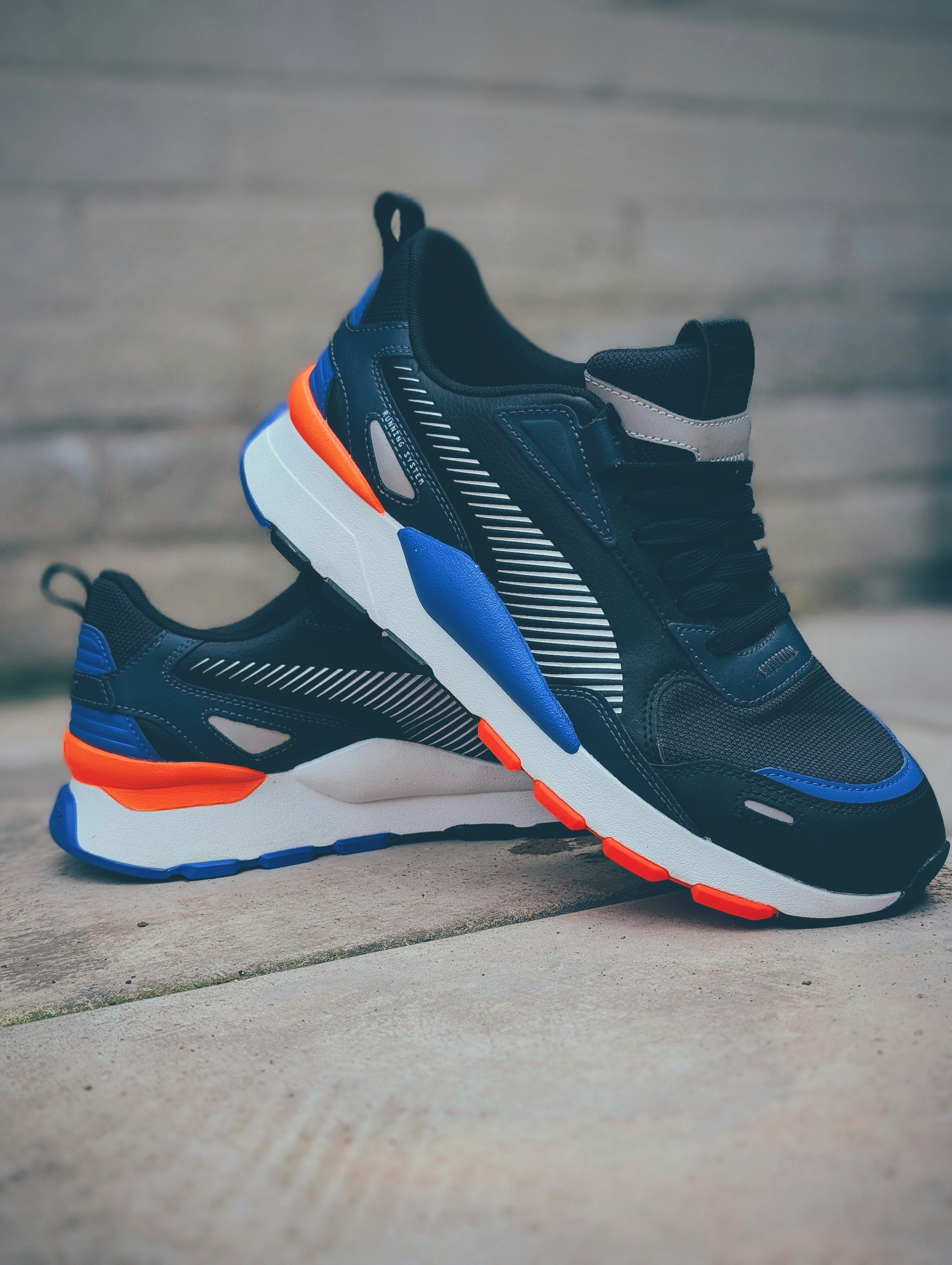 Here's a caption: puma sneakers: black and colorful design. photo ...
