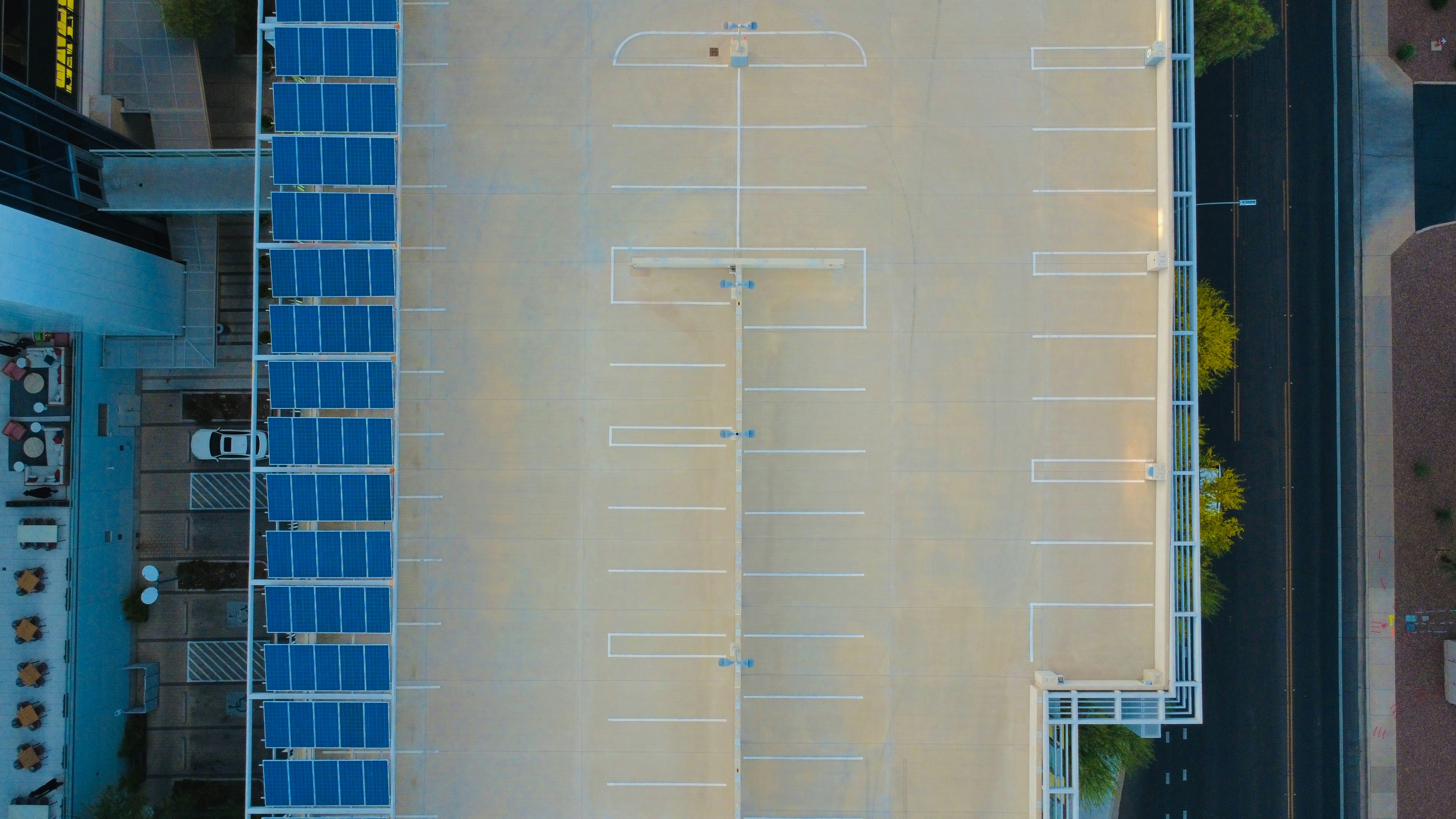 Aerial view of a parking garage roof with solar panels. photo – Free ...