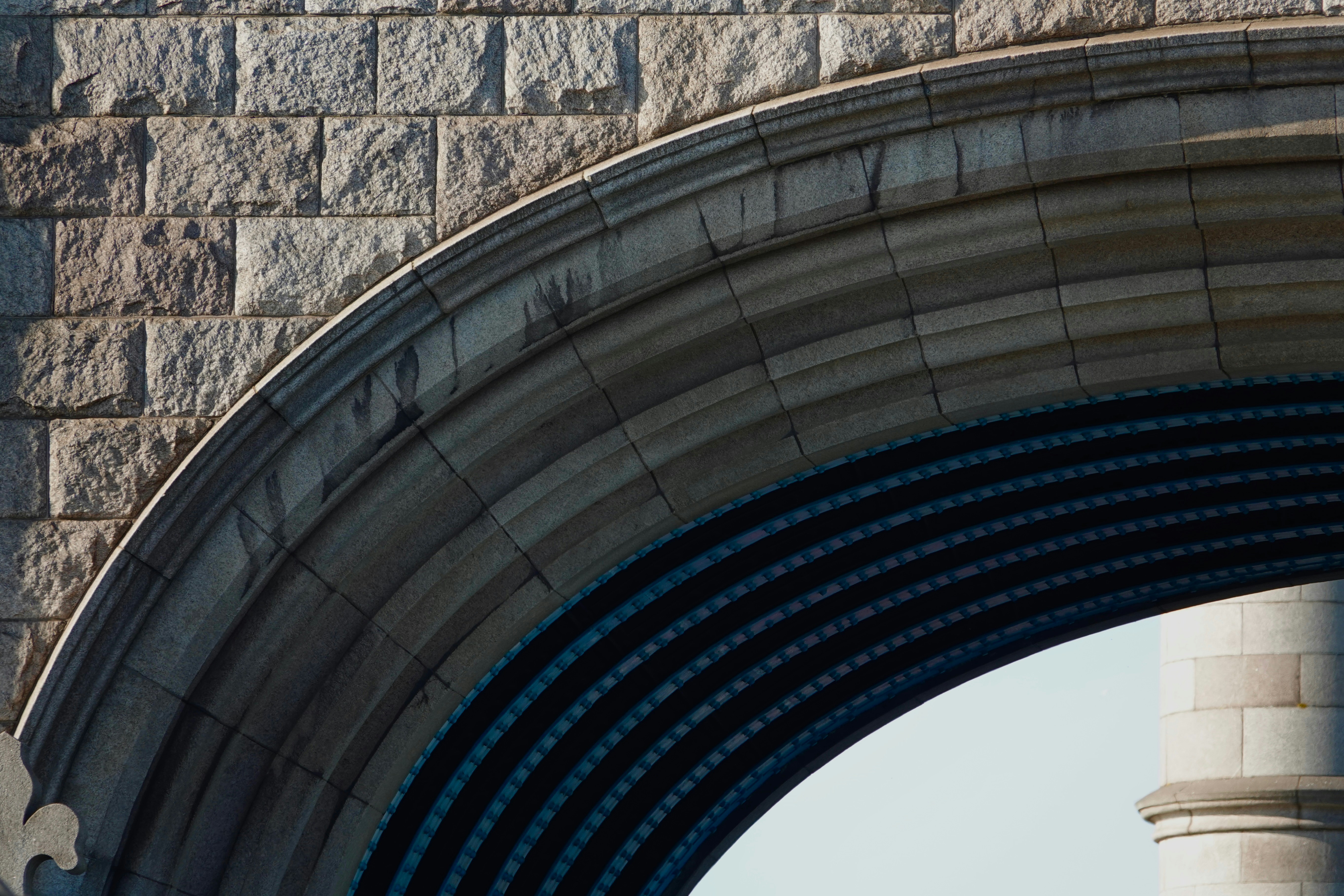 Arched stone structure with a detailed design.