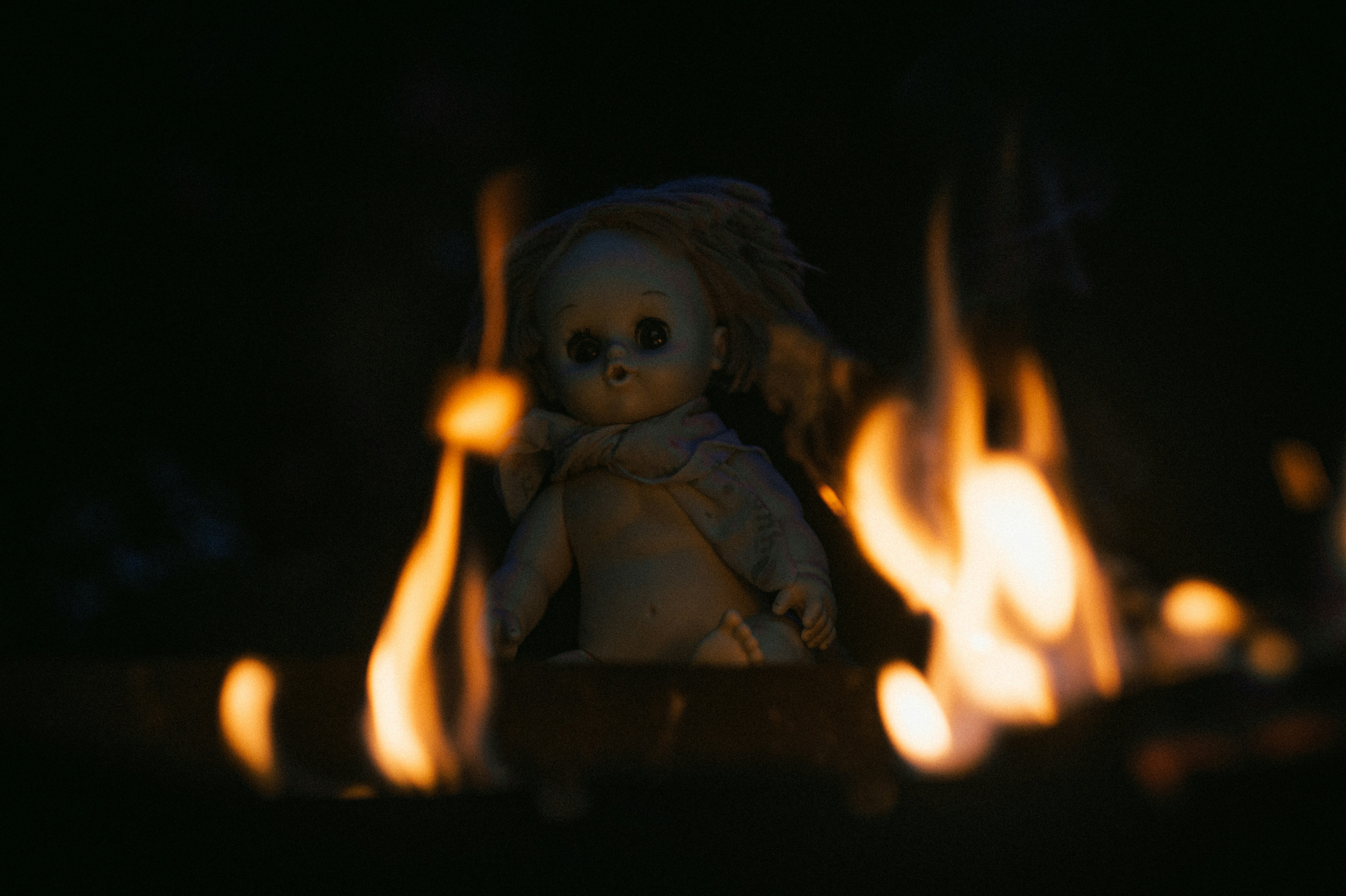 A creepy doll burns in the fire. photo – Free Creepy Image on Unsplash