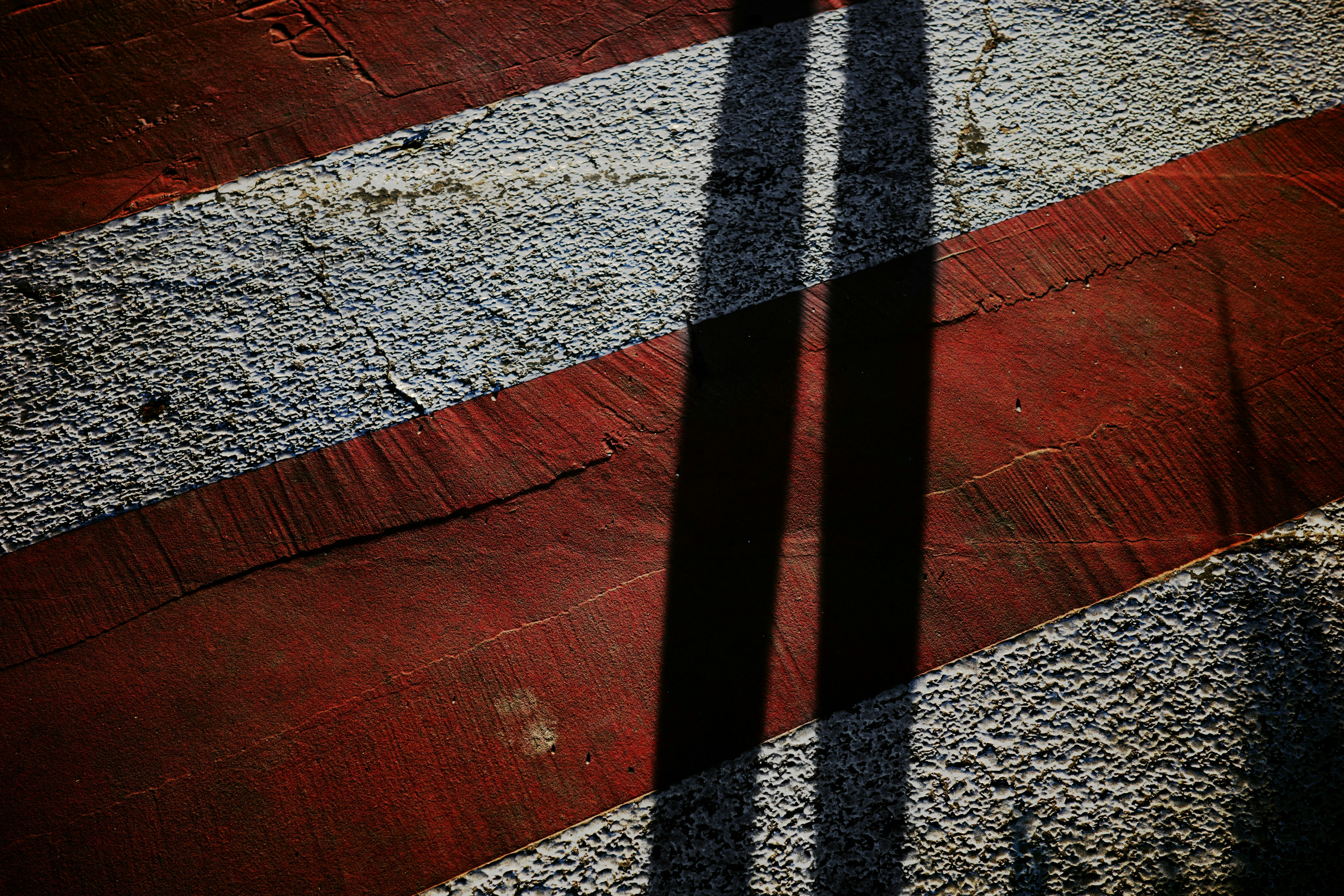 Shadows and red stripes on a textured surface. photo – Free Abstract ...