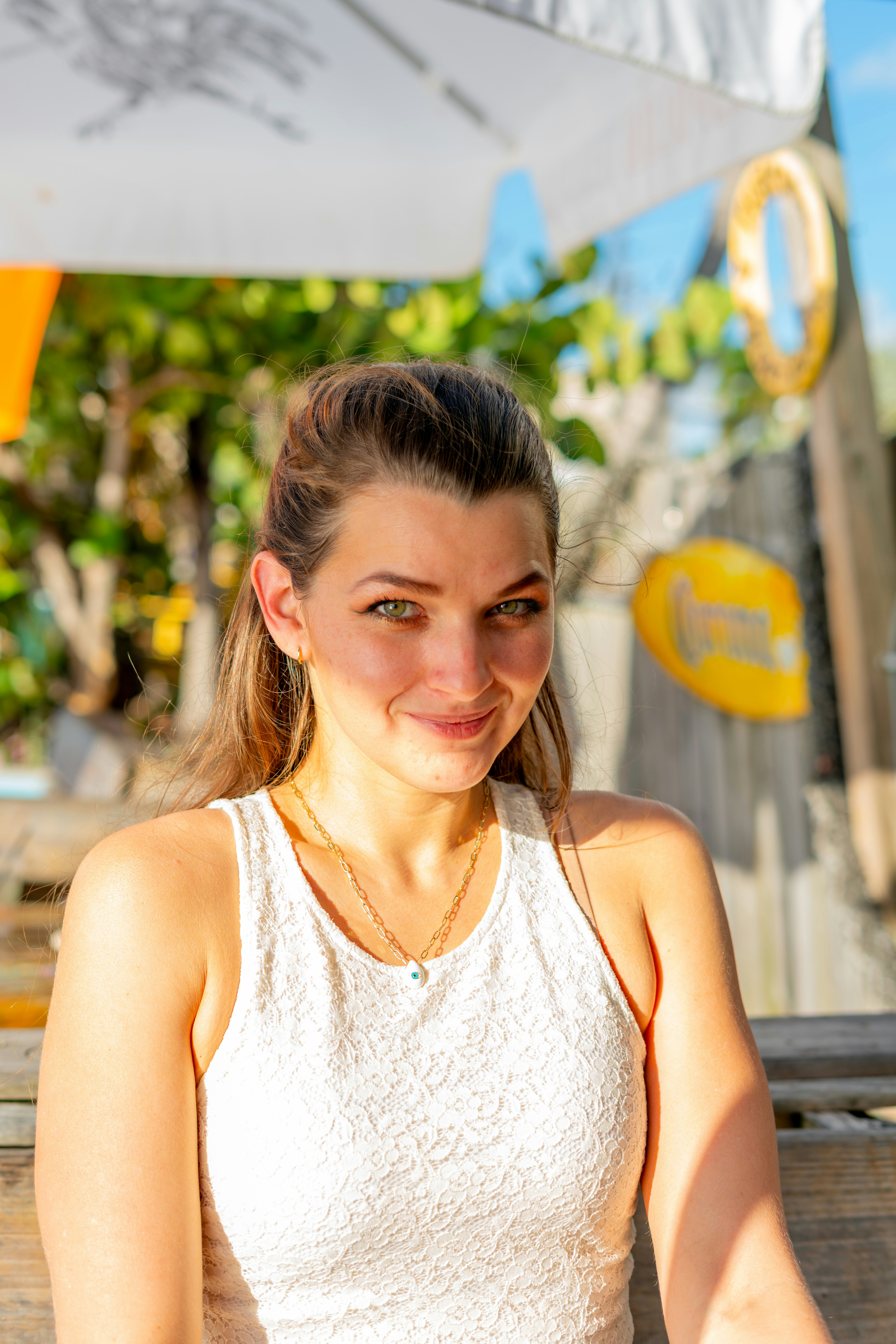 Sunlit Smile on a Summer Terrace: Casual Outdoor Portrait