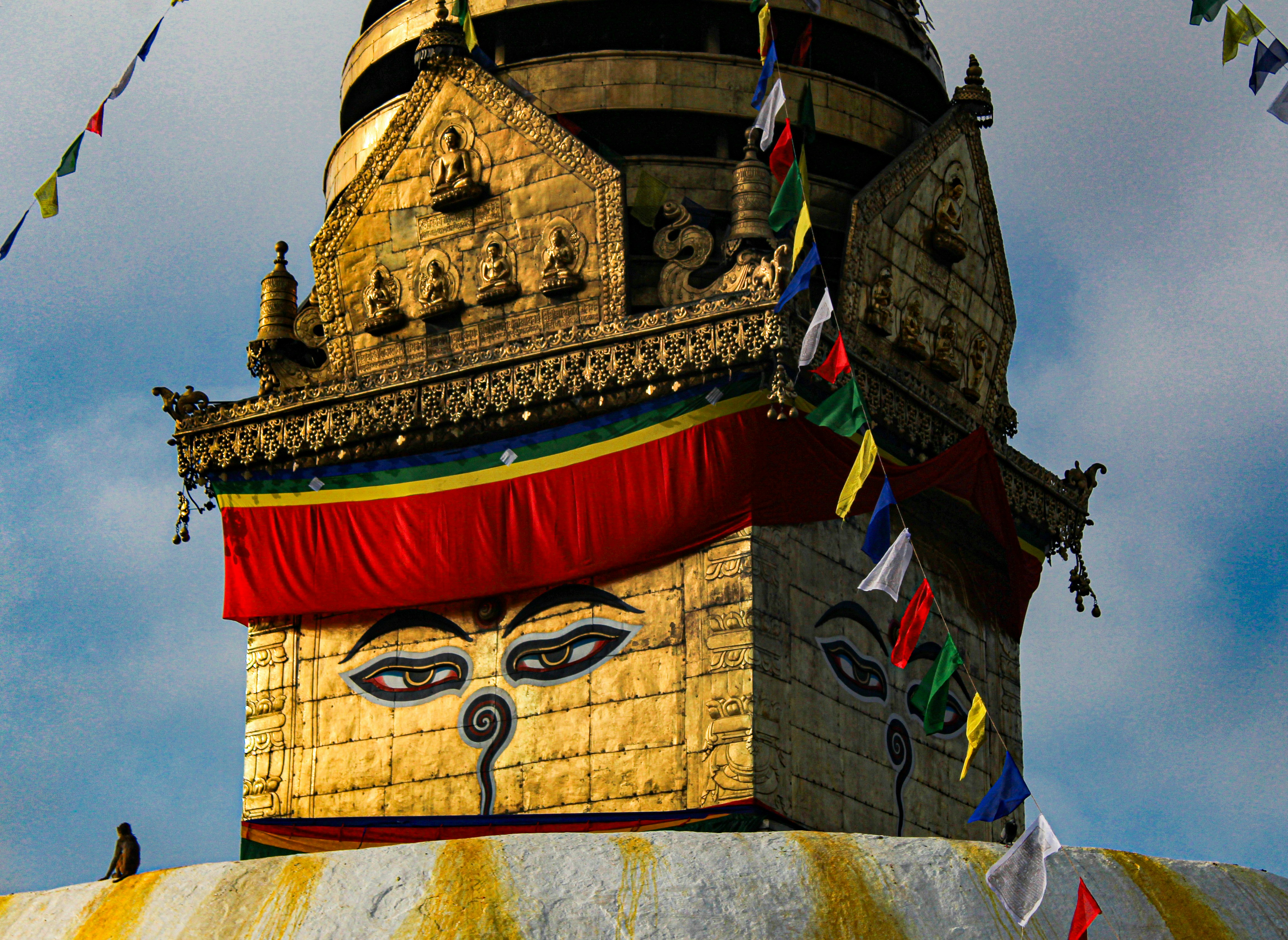 A golden stupa with painted eyes stands tall. photo – Free Nepal Image ...
