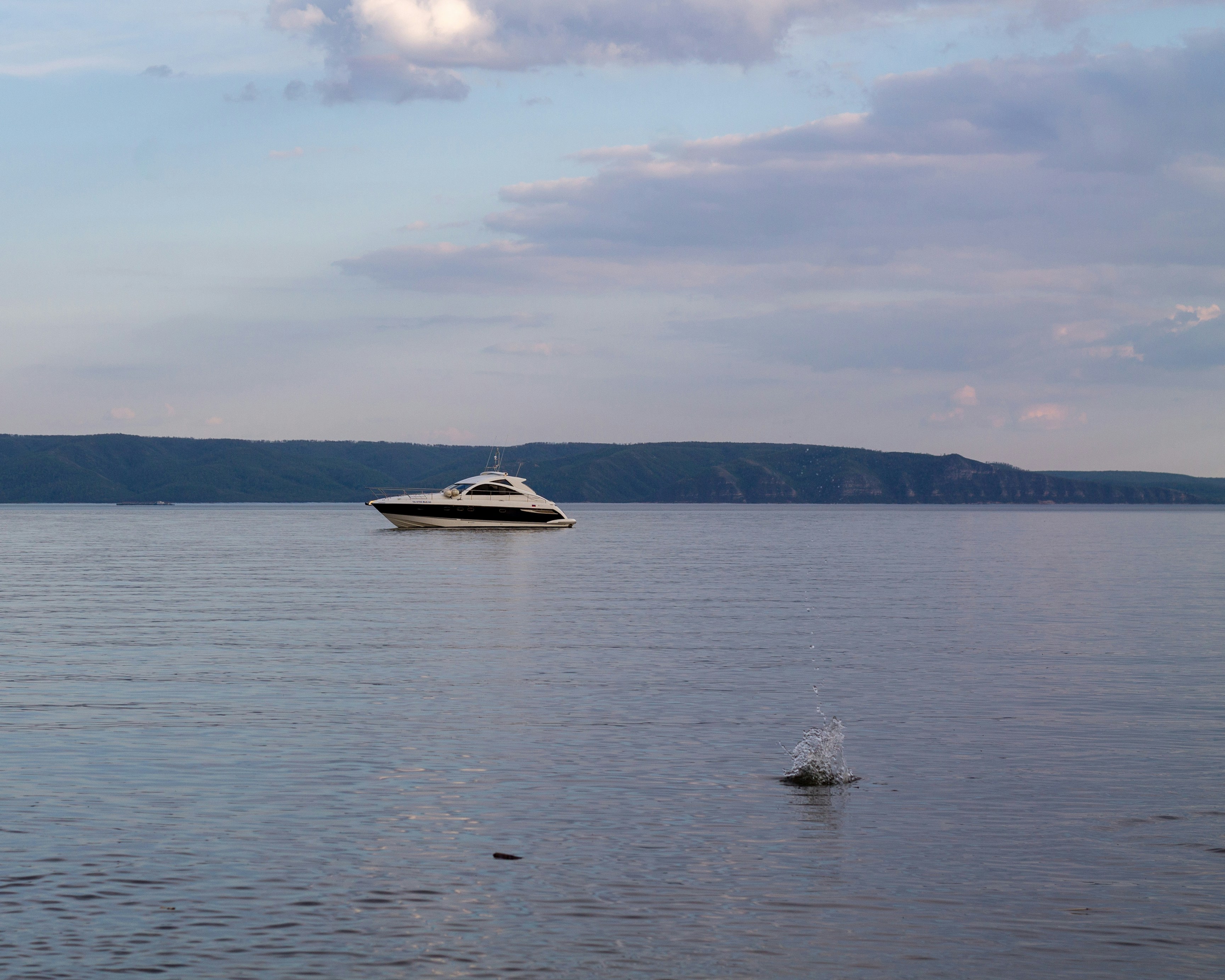 Glassy Lake, Lone Yacht Beneath a Cliff-Line Horizon