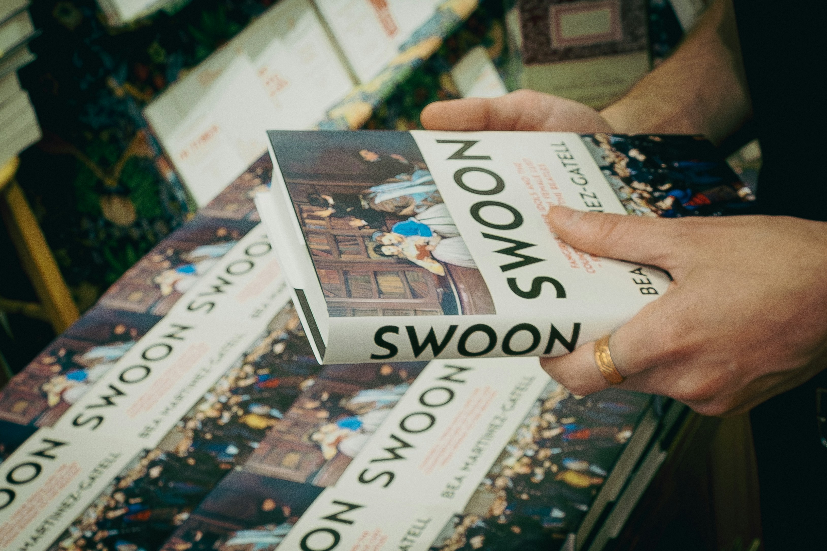 Someone holds a book titled "swoon." photo – Free Book Image on Unsplash