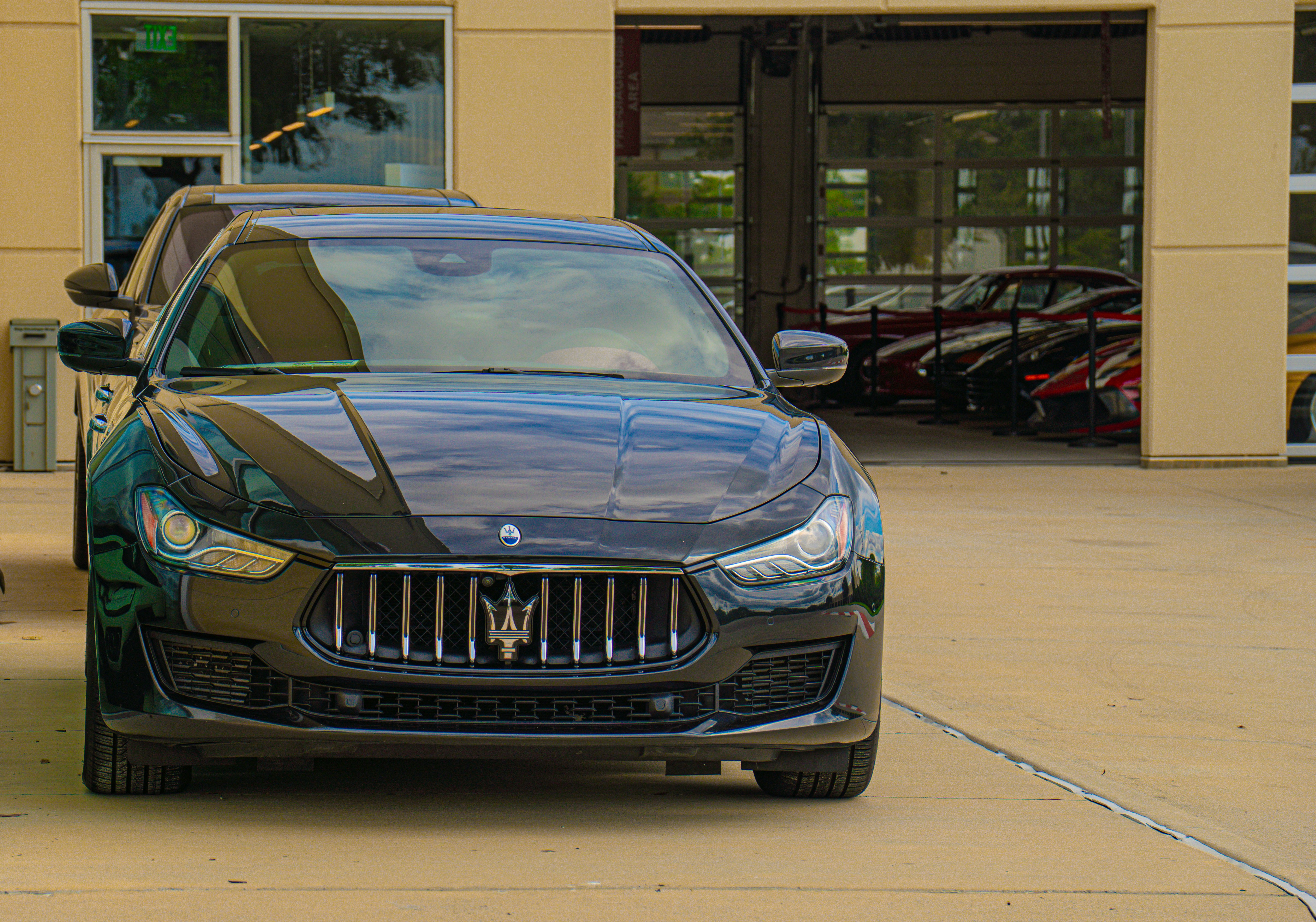 Low-slung Maserati in a Sunlit Car Shop Preview