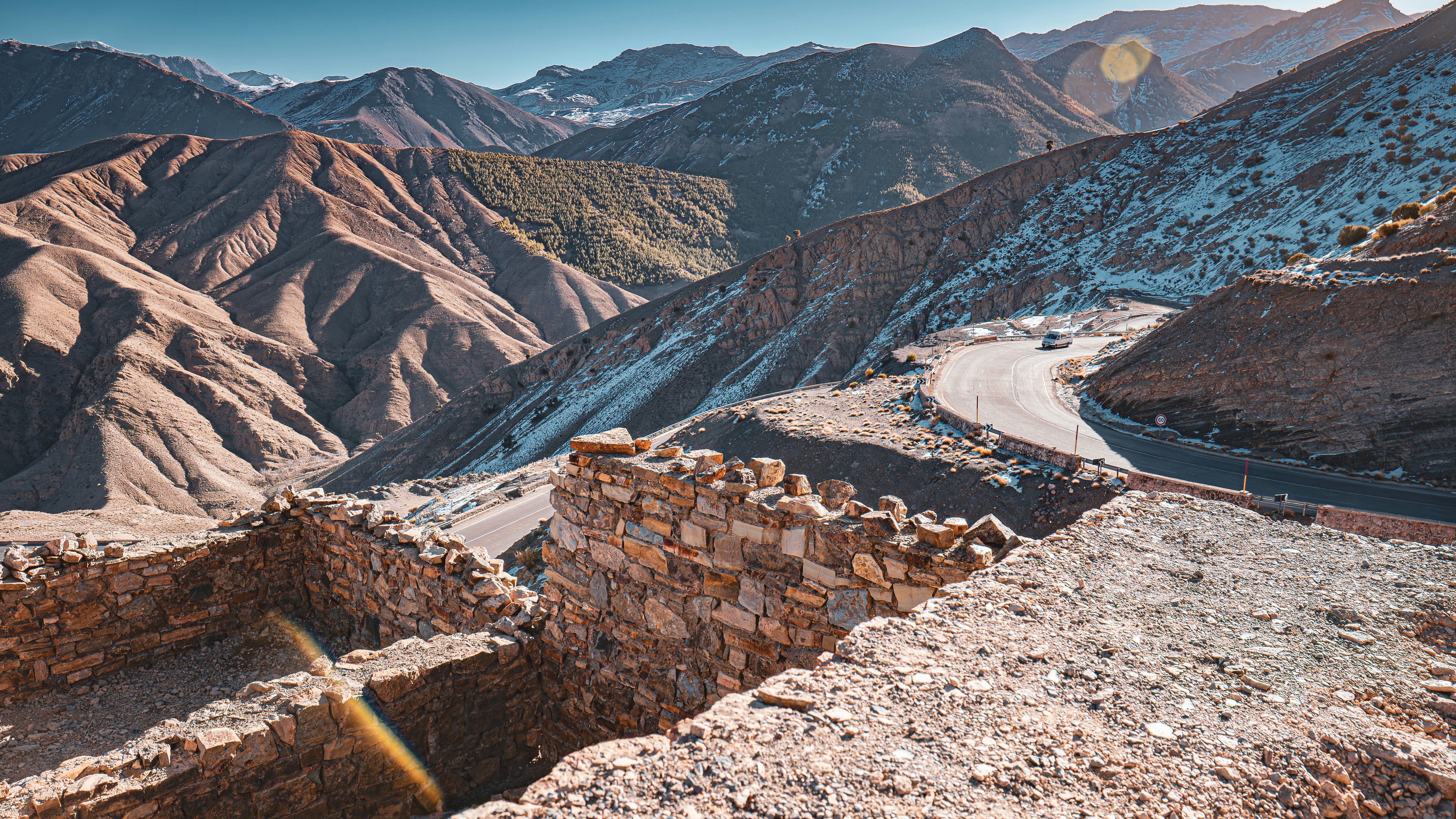 Winding Spine of the Canyon: Stone Walls and Sunlit Peaks