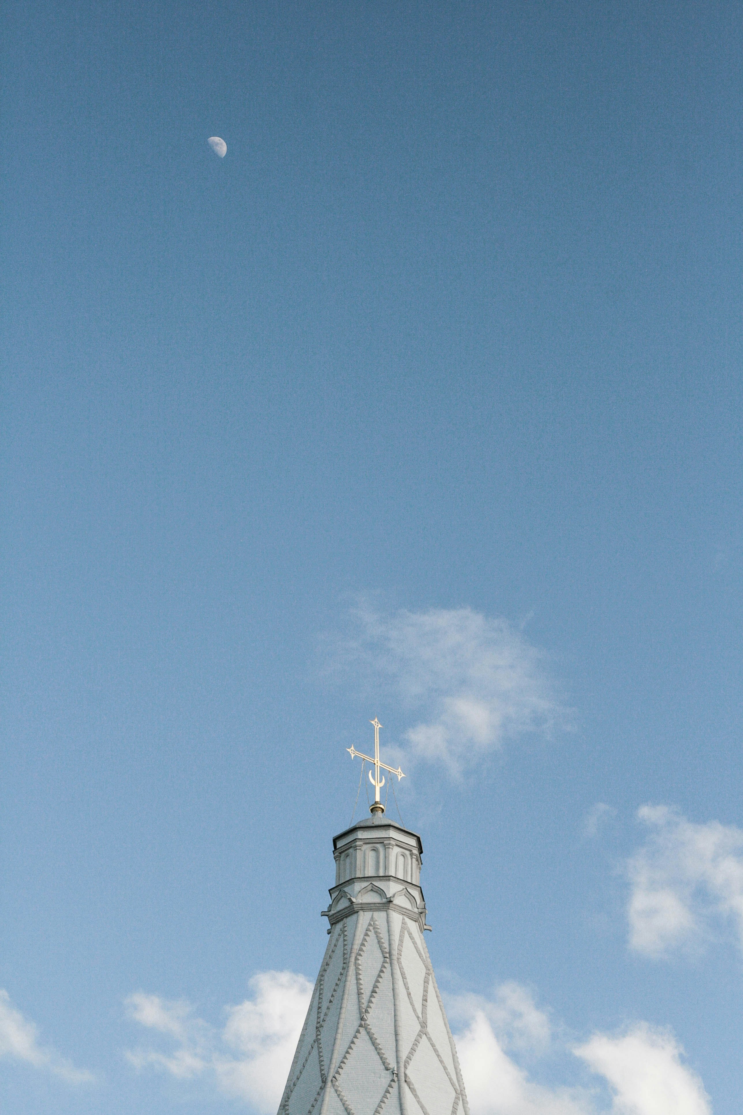 Church steeple with a cross points towards the moon. photo – Free Moon ...