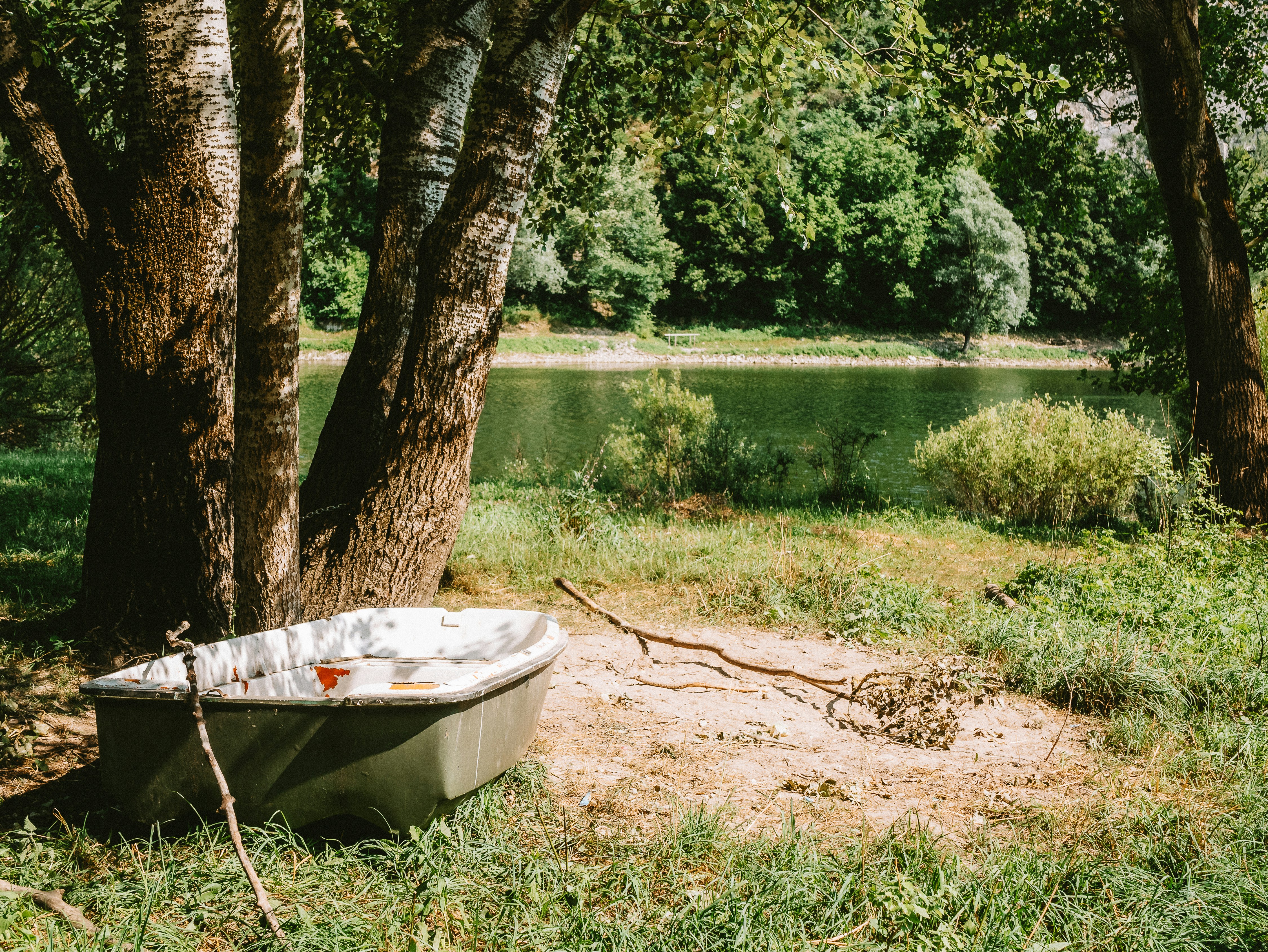 Abandoned Rowboat by a Quiet Riverside