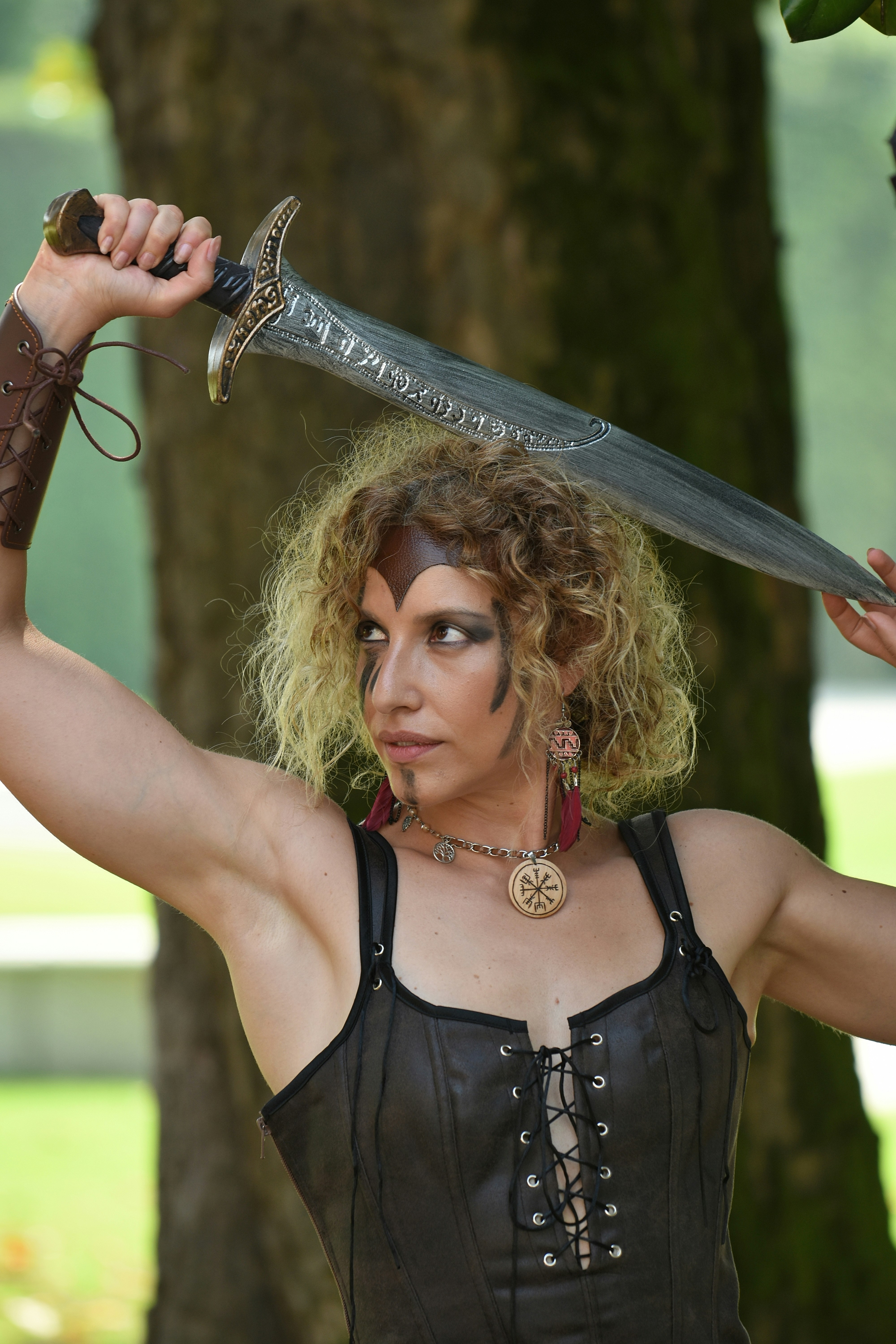 Curved Blade in the Pines: A Leather-Wrapped Warrior Takes the Stance
