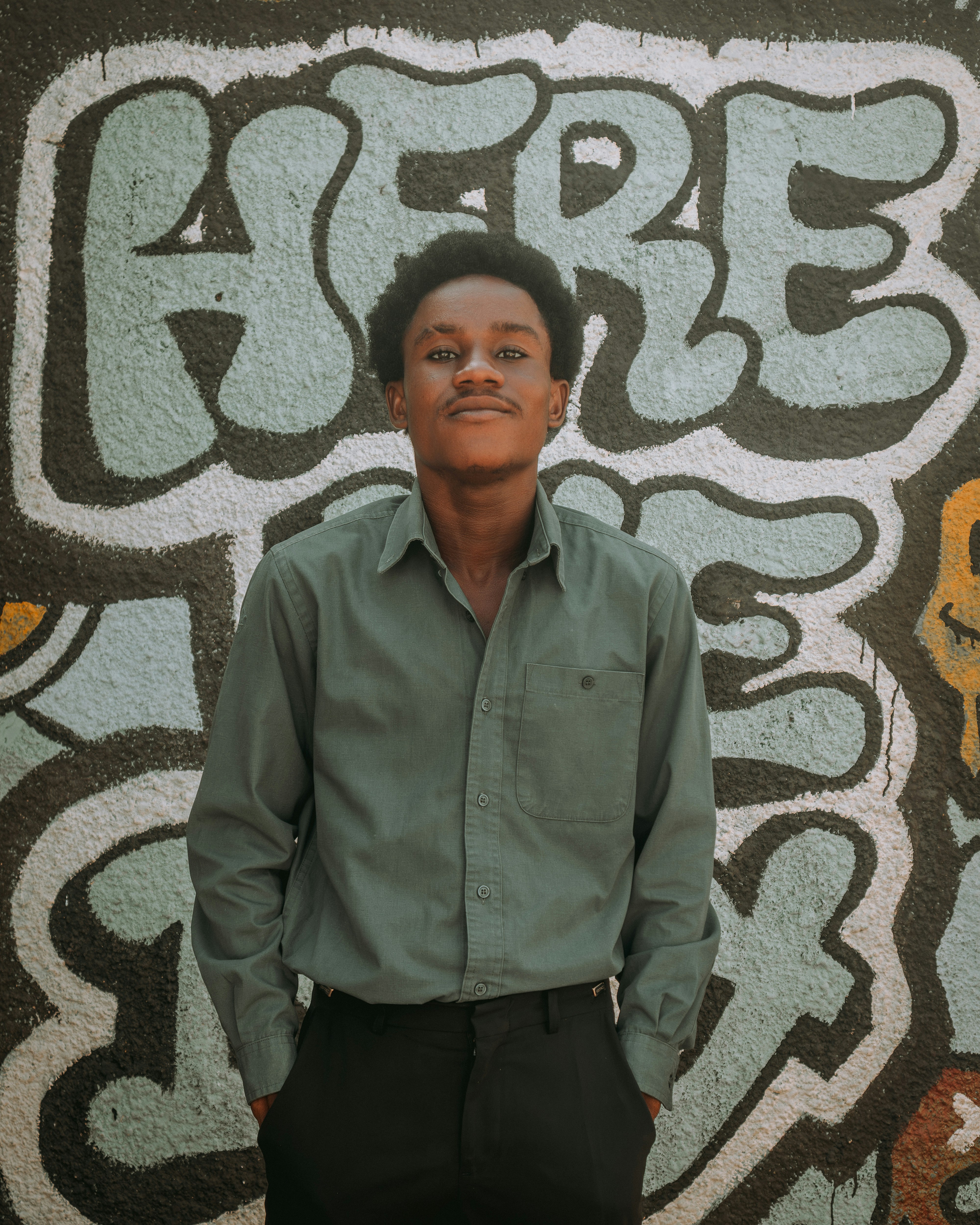 Urban Expression: A Portrait Against the Canvas of Street Art