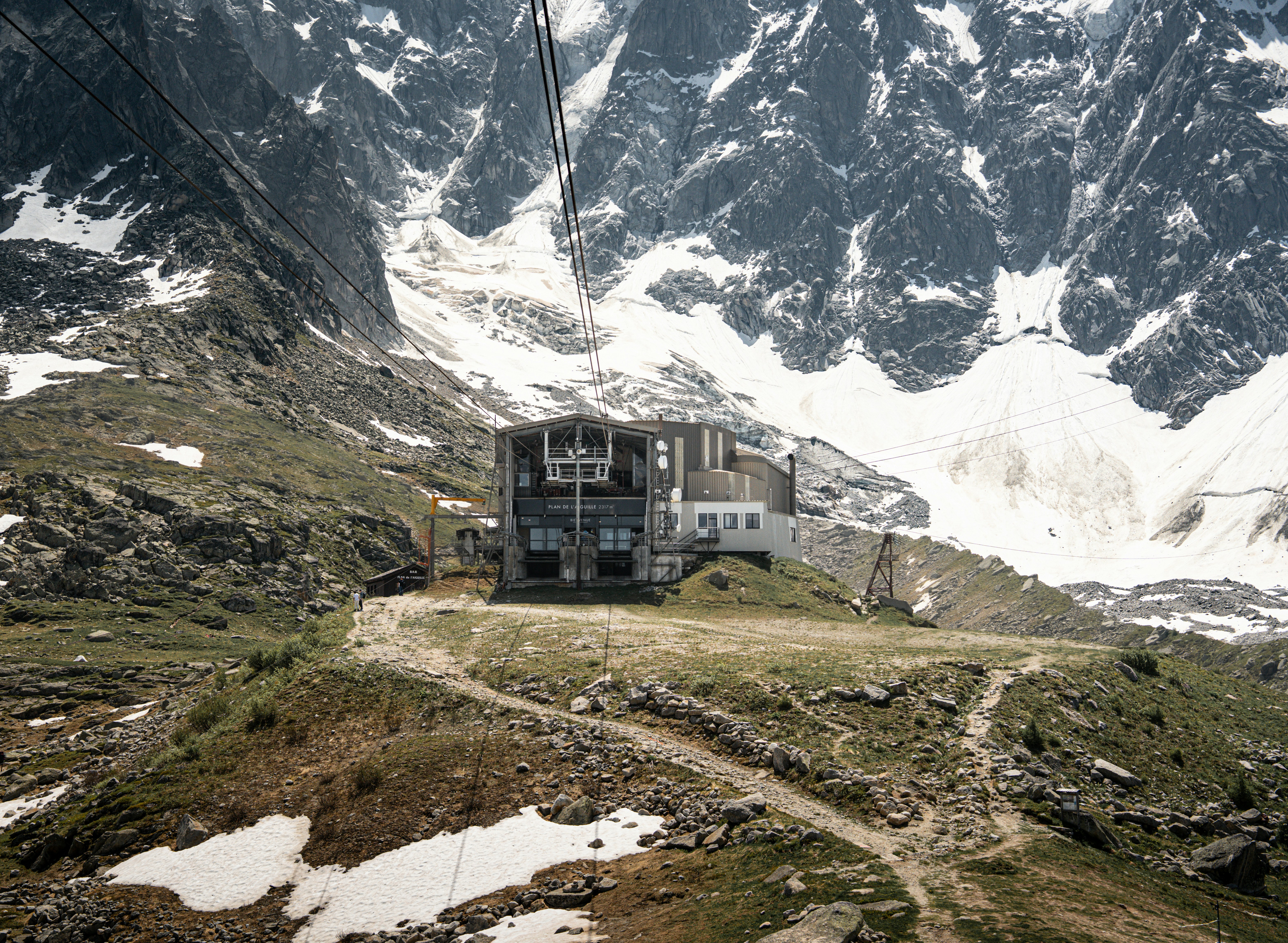 A ski resort at the base of a snowy mountain.