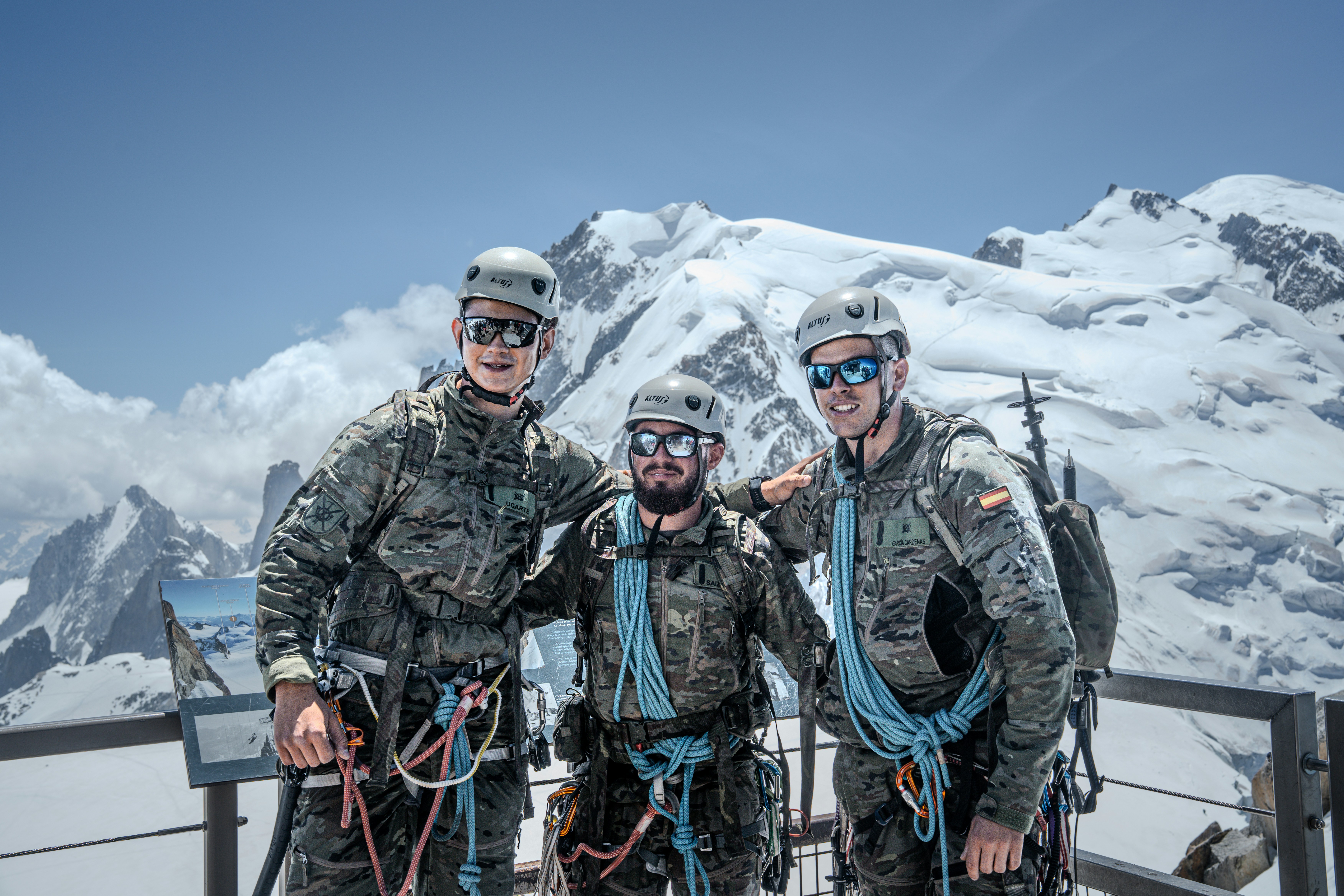 Alpine Lookout: Three Climbers on a Snowy Ridge