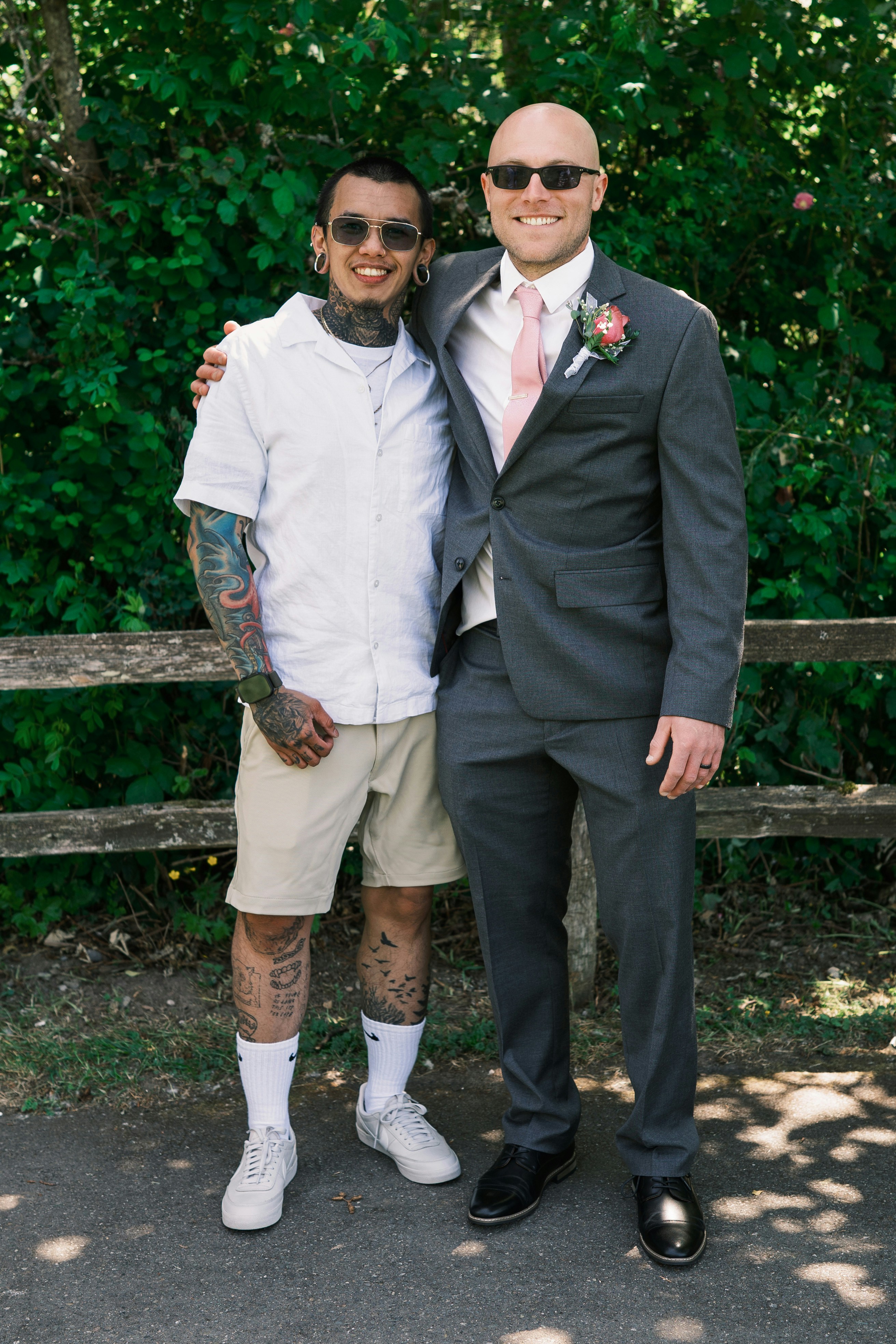 Two men smile while posing for a photo. photo – Free Portrait Image on ...