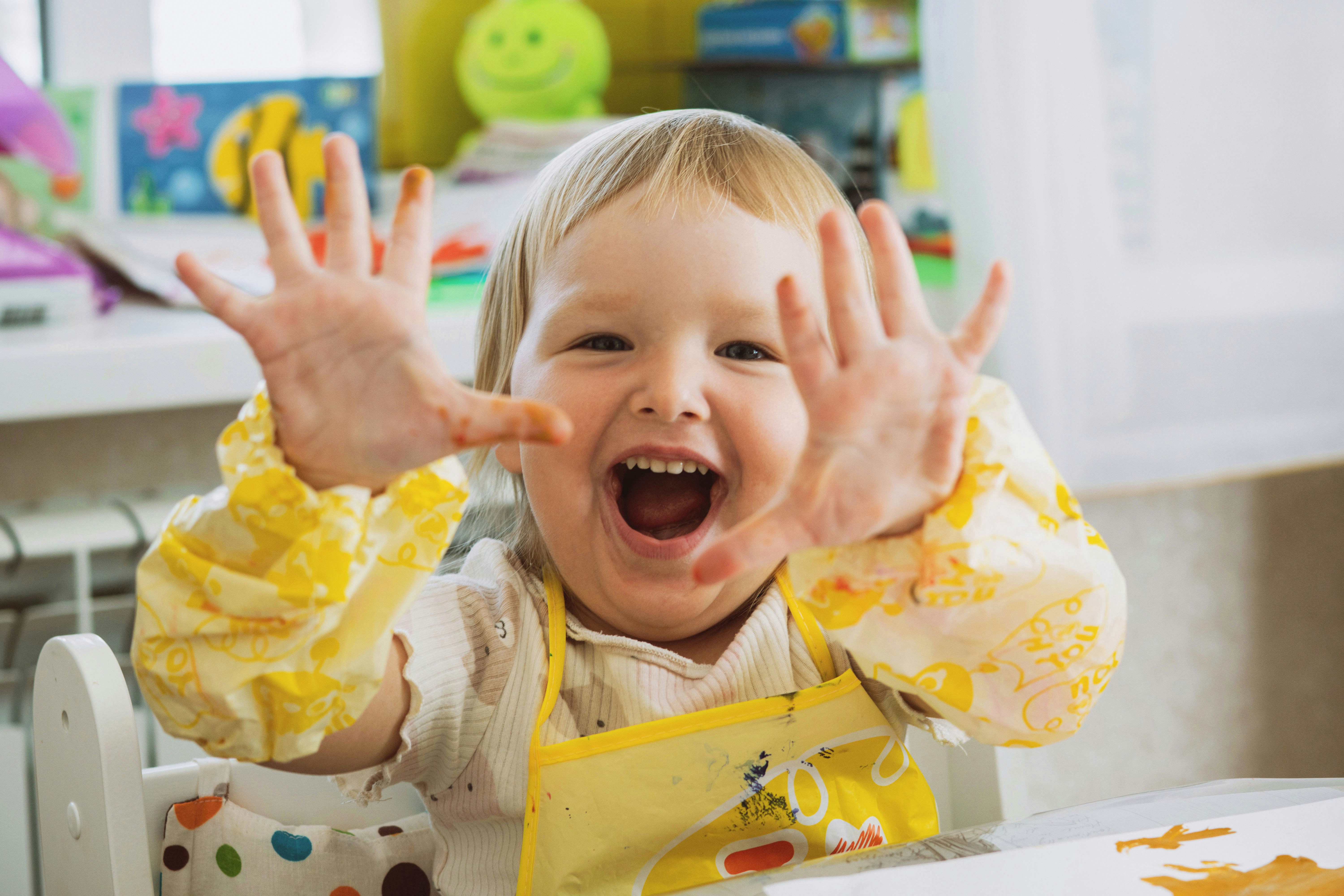 Happy child shows off colorful, messy hands. photo – Free Face Image on ...