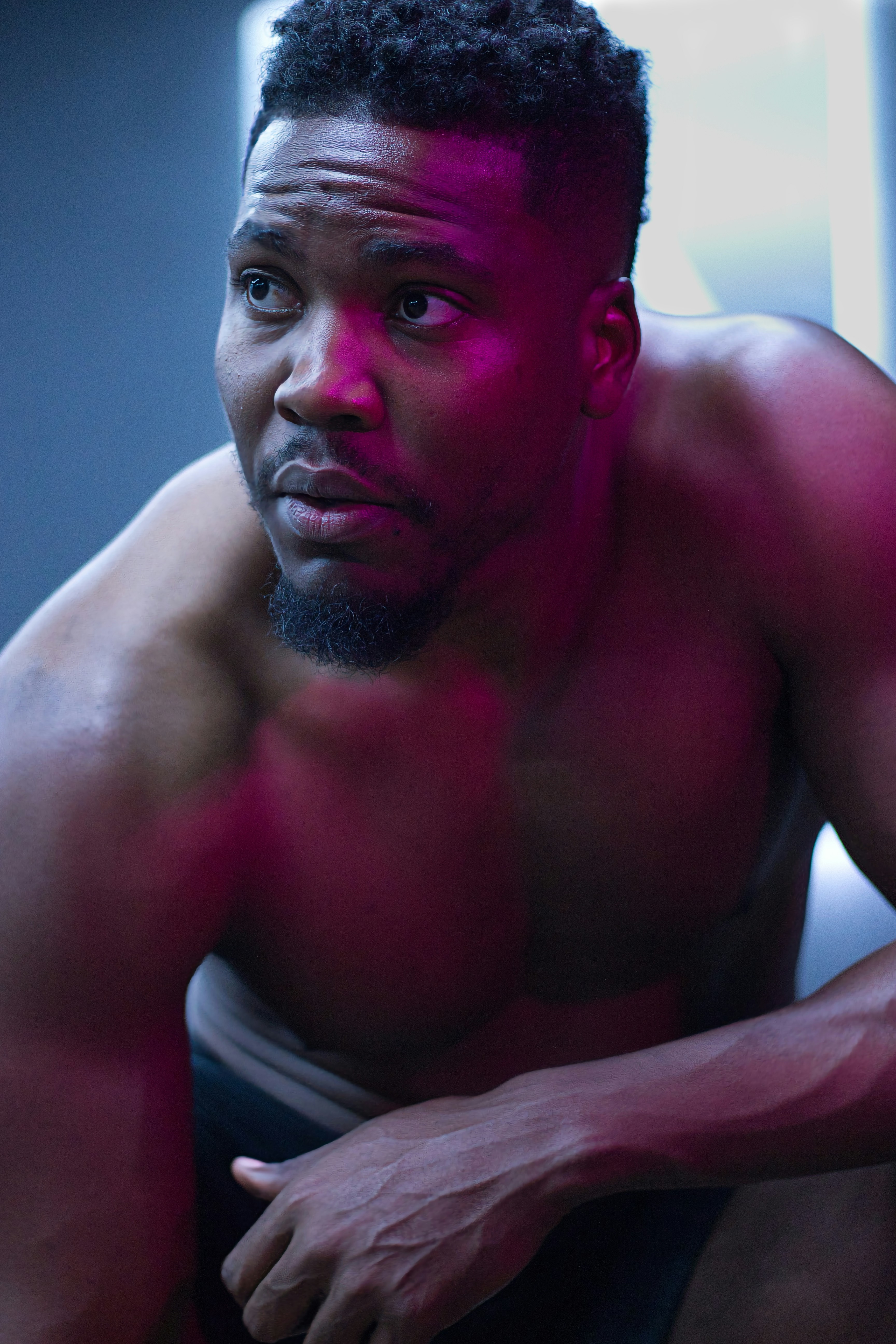 A muscular man stares intently, looking concerned. photo – Free People ...