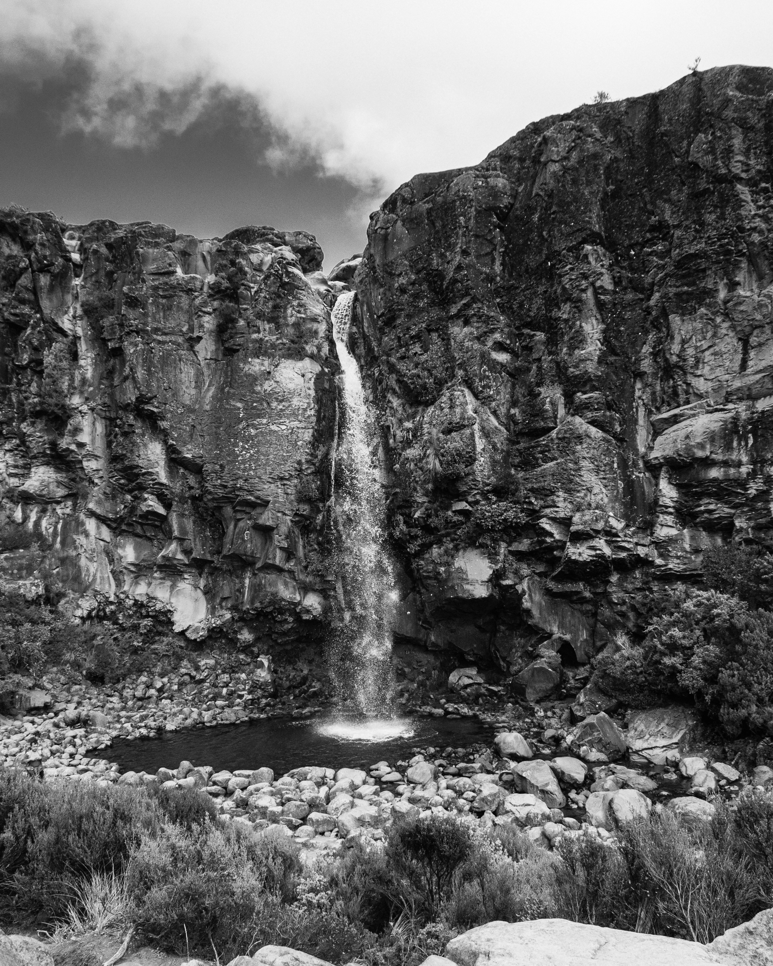 Stone Curtain Between Cliff Faces: A Monochrome Waterfall