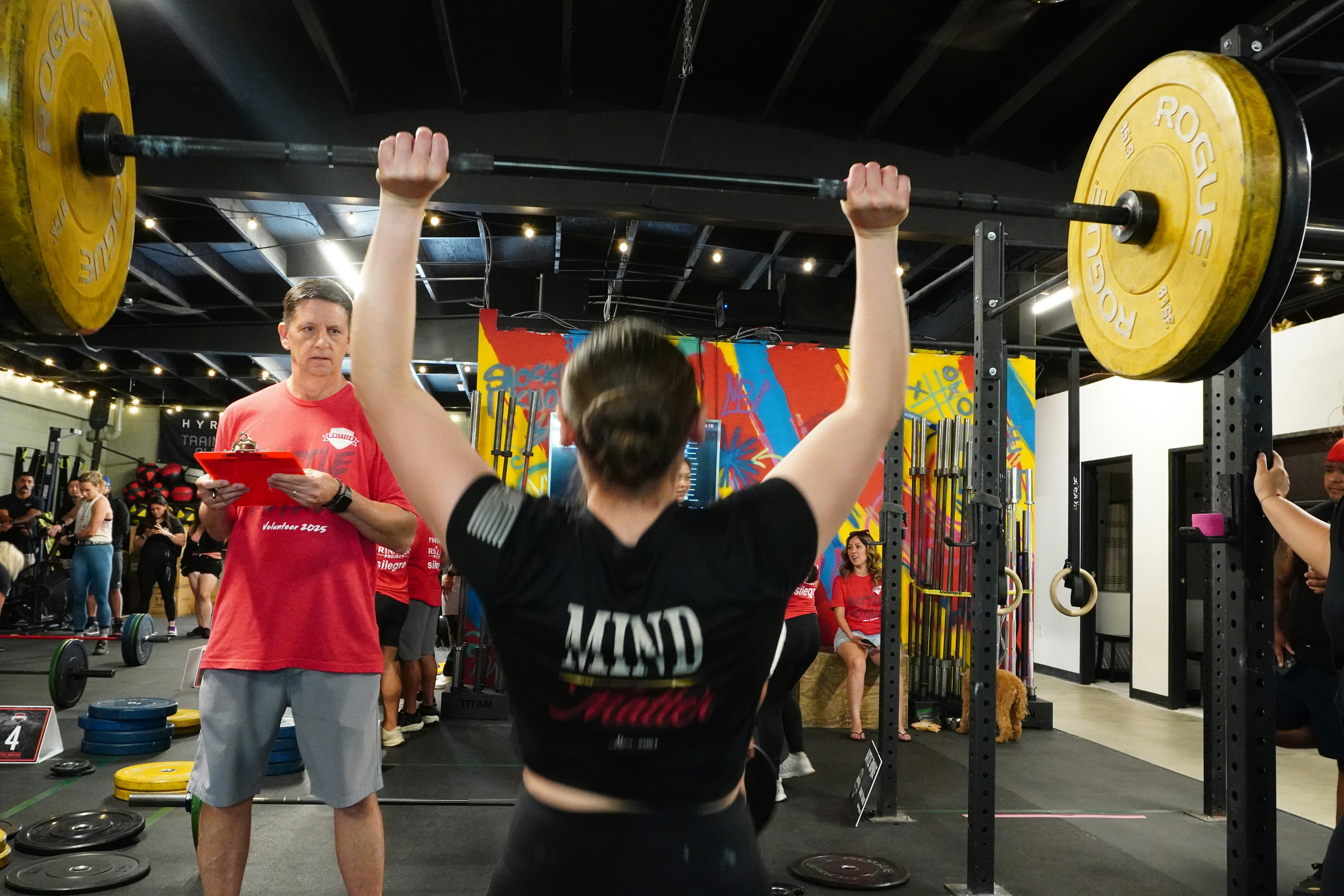 Woman performs a heavy overhead weight lift. photo – Free Man Image on ...