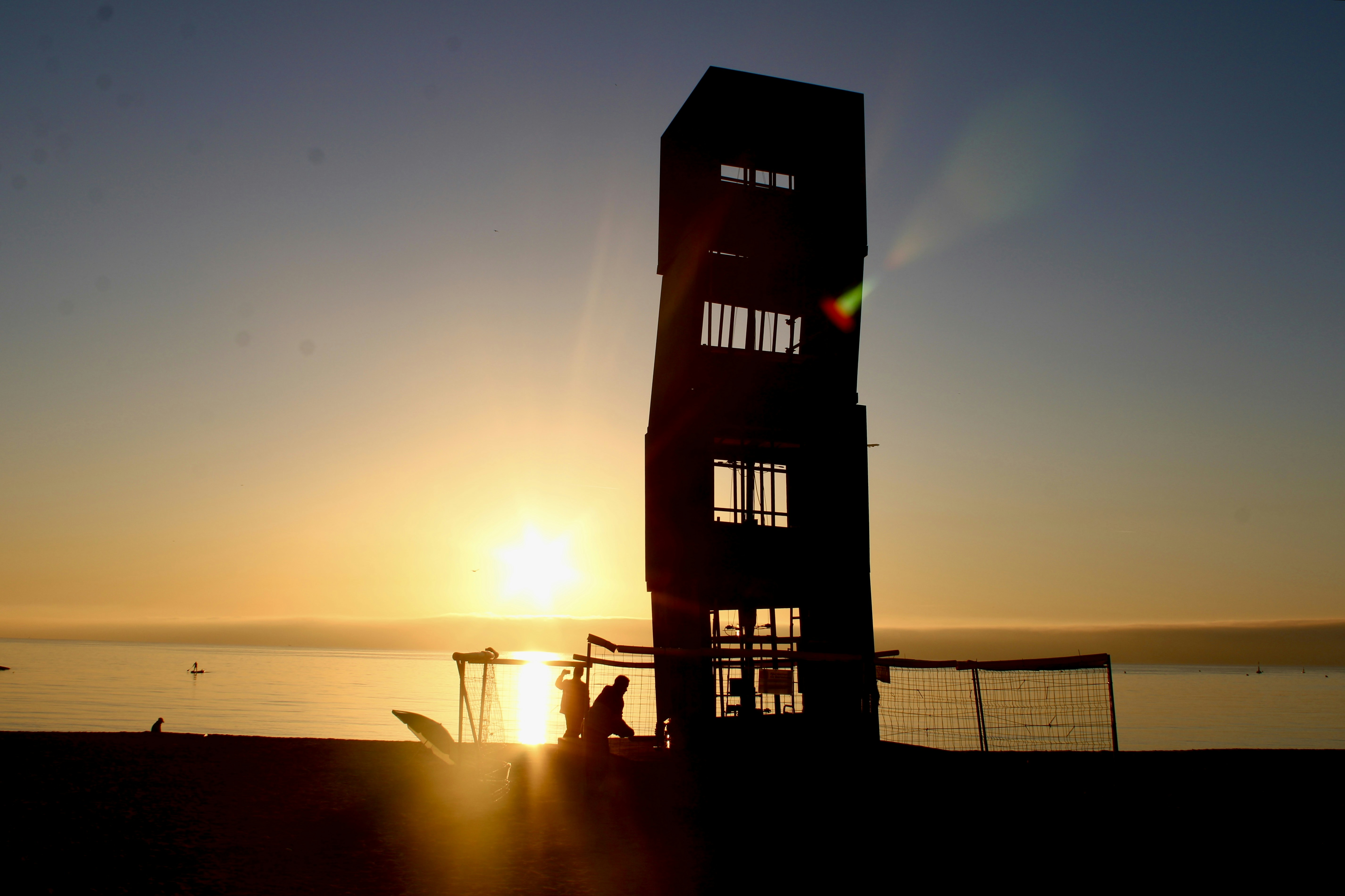 Dusk Watchtower: A Quiet Beach Silhouette at Golden Hour