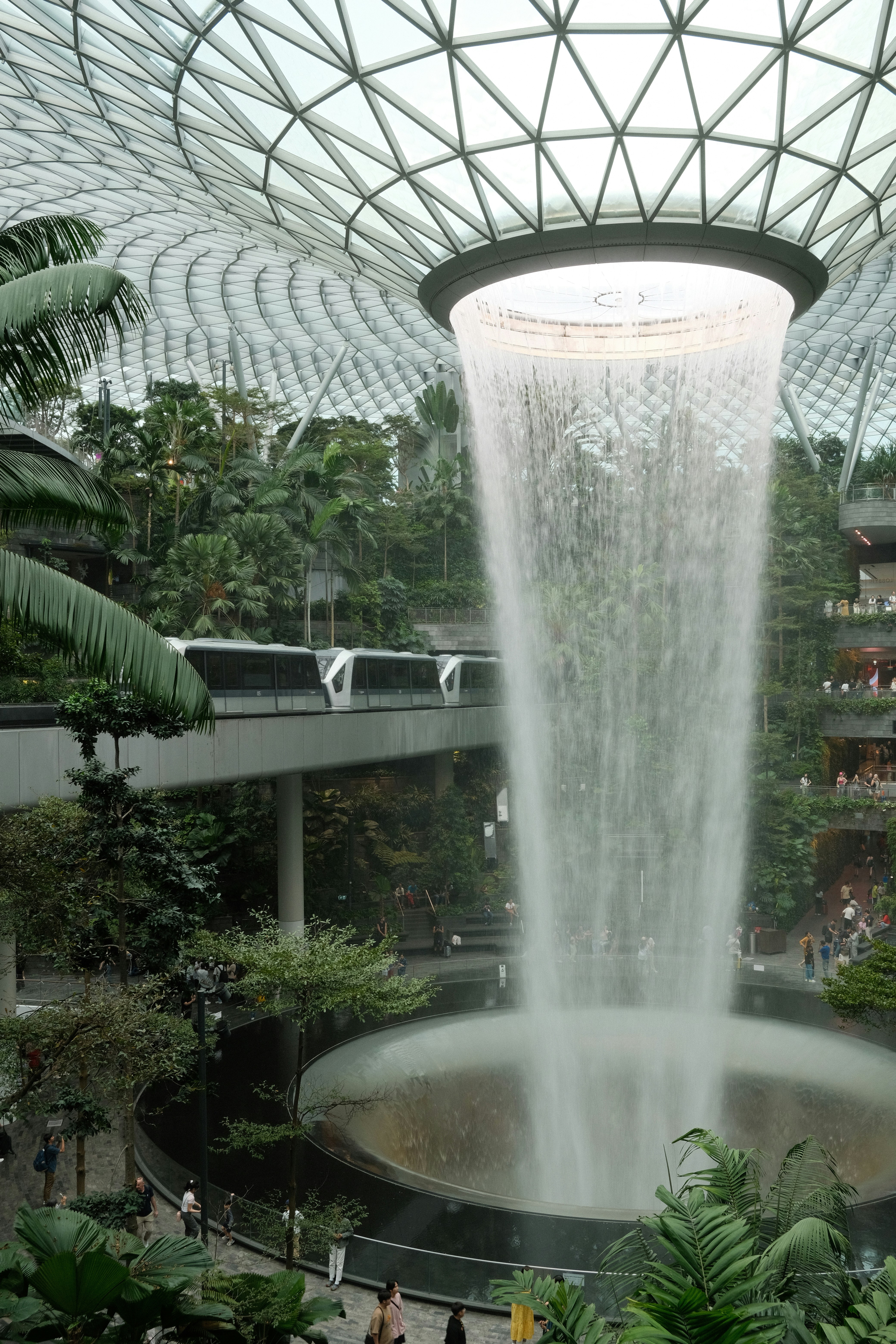 Vertical Veil: Waterfall Enclosed by a Crystal Dome