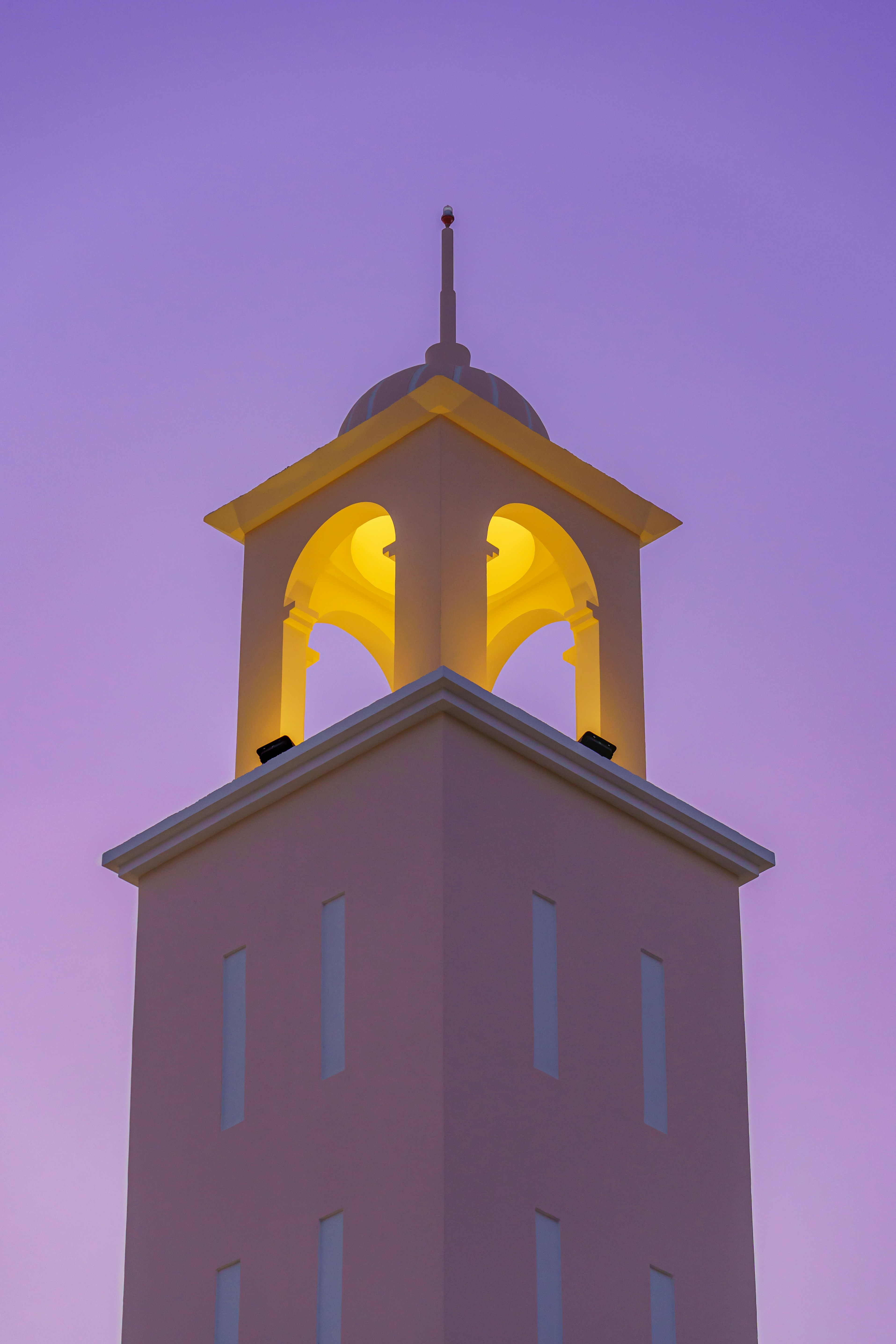 Tower illuminated with a purple sky backdrop. photo – Free Dusk Image ...