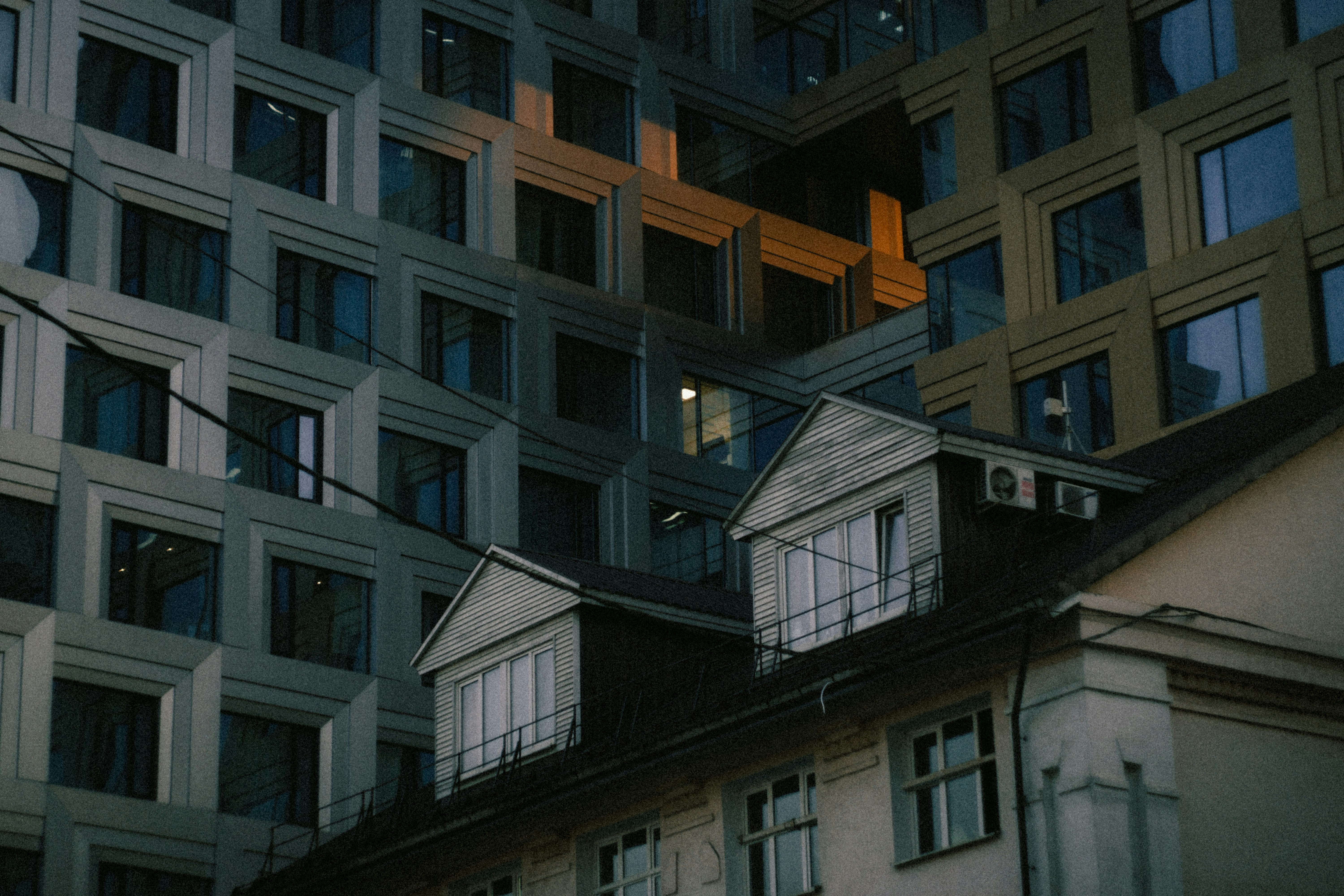 Dormers Against the Glass Grid: Echoes of Old and New Architecture