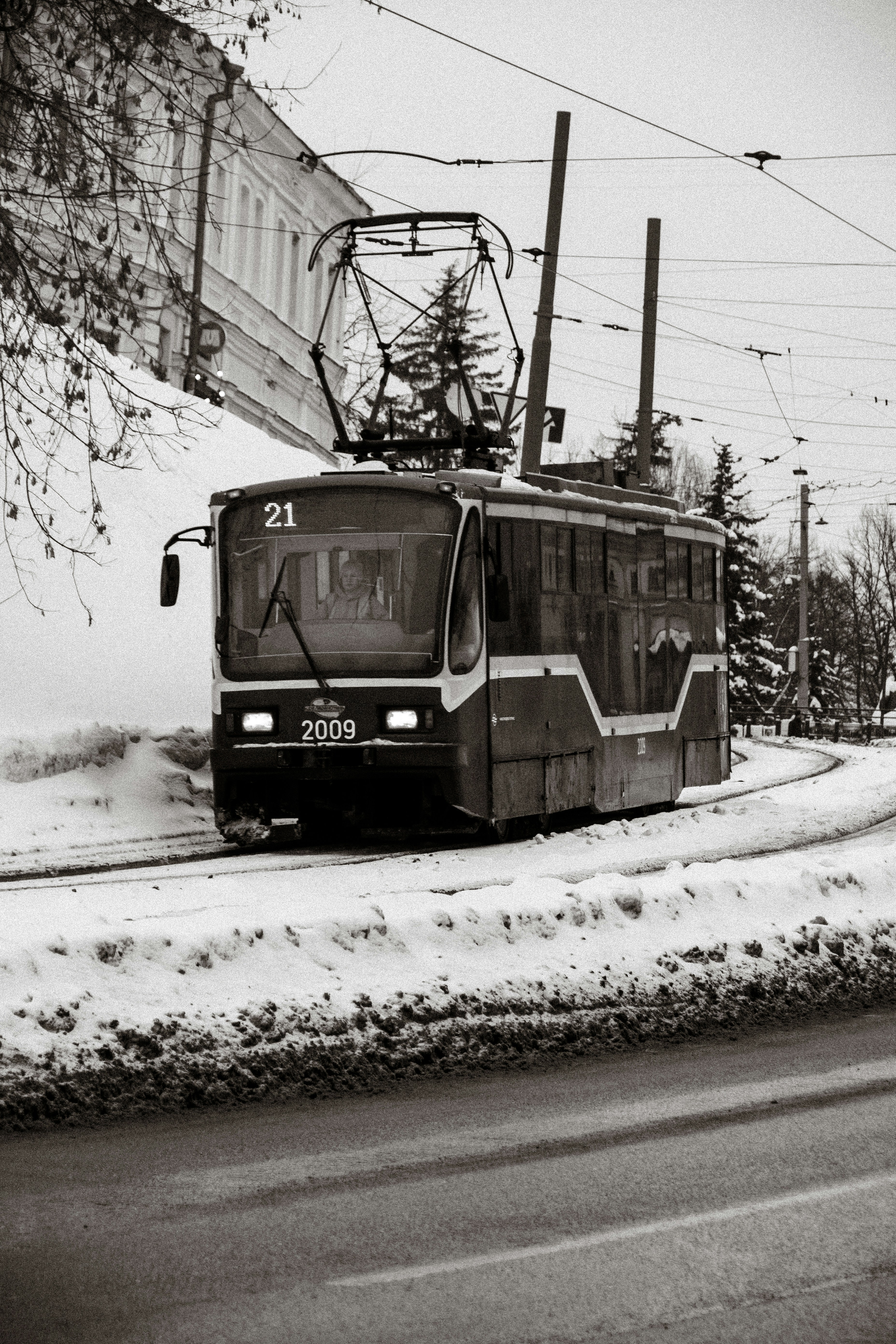 Snowbound Streetcar: A Curved Moment in a Monochrome Winter