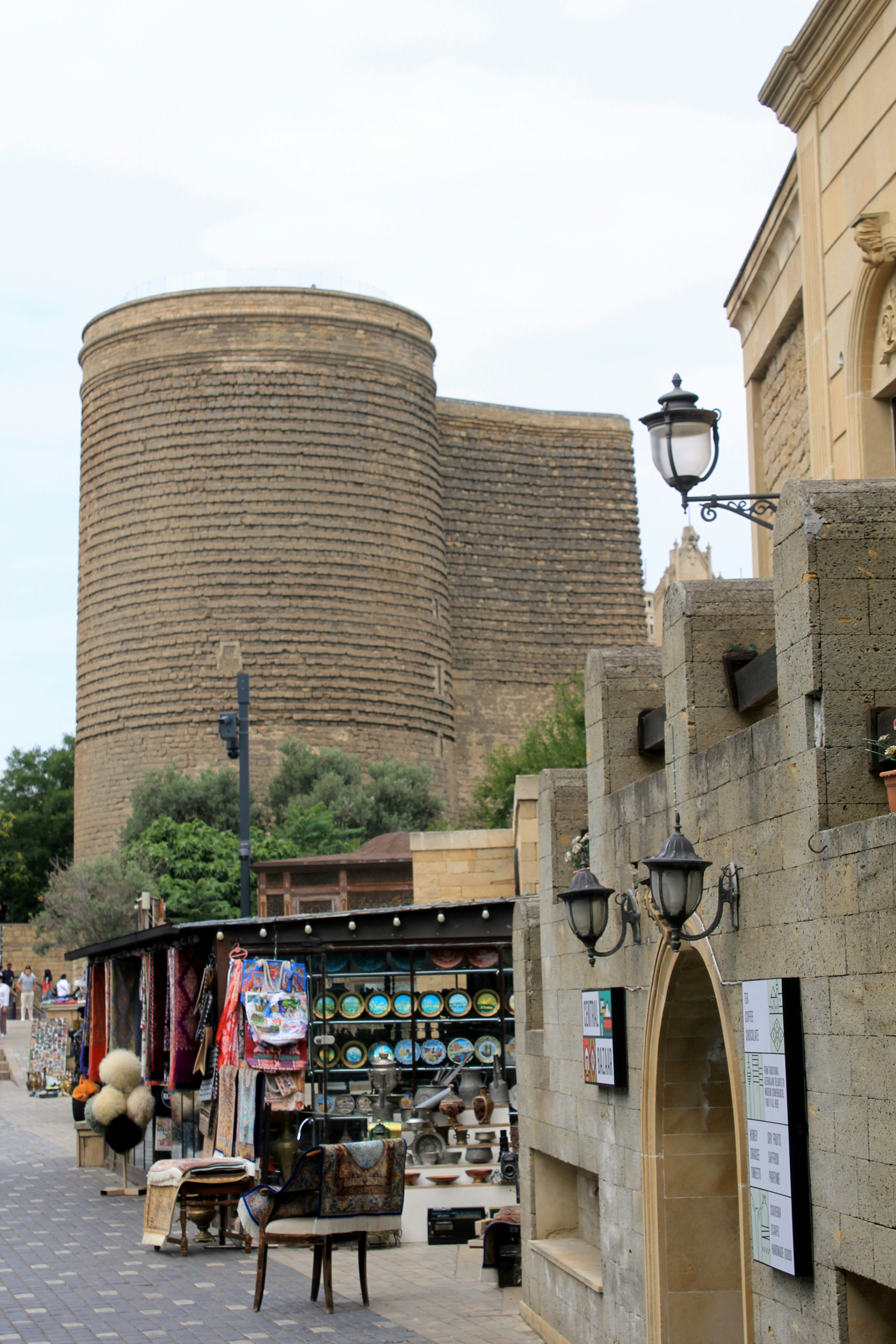 Circle-Towered Backdrop Over a Bustling Market Street