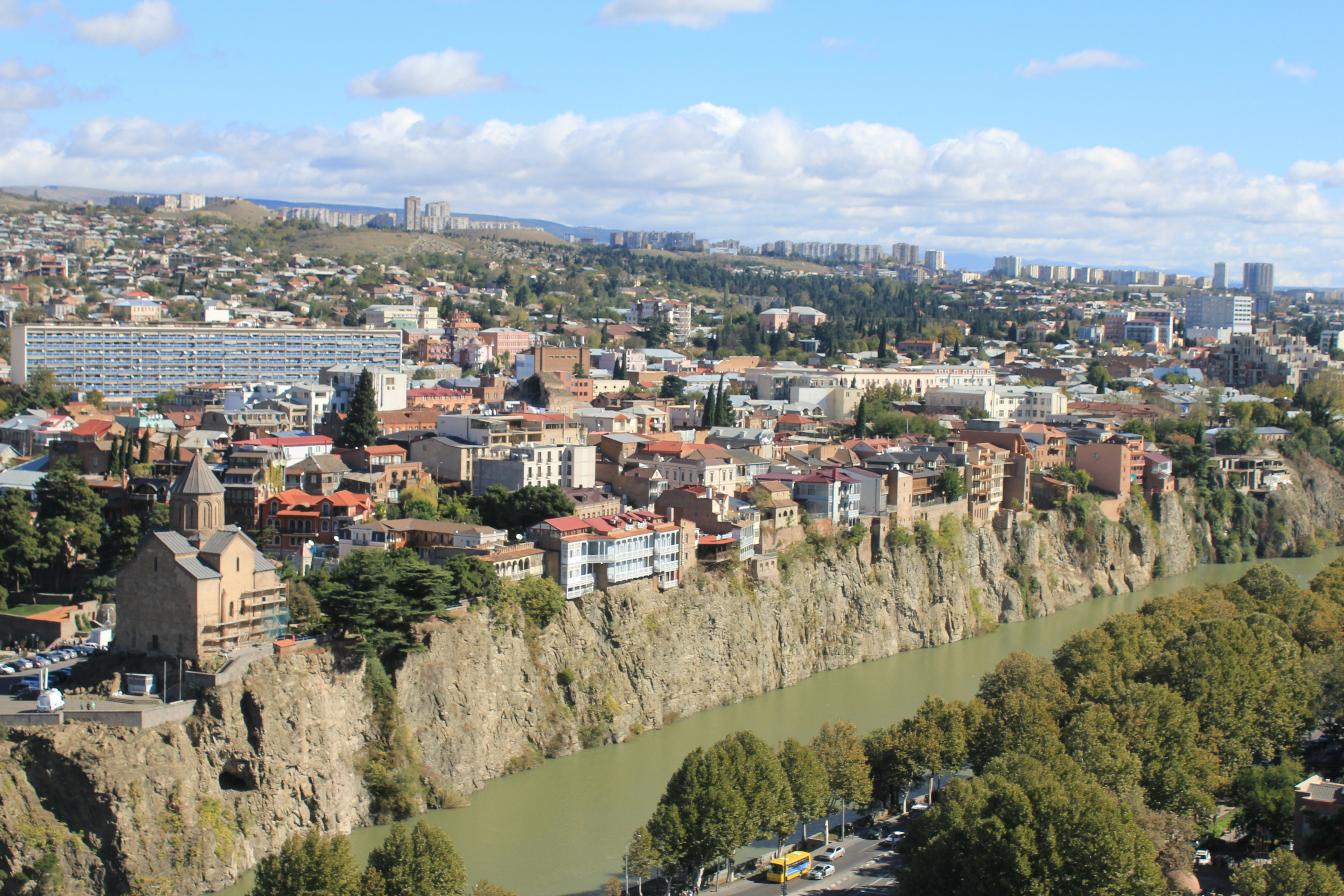 Aerial view of a scenic city by the river.