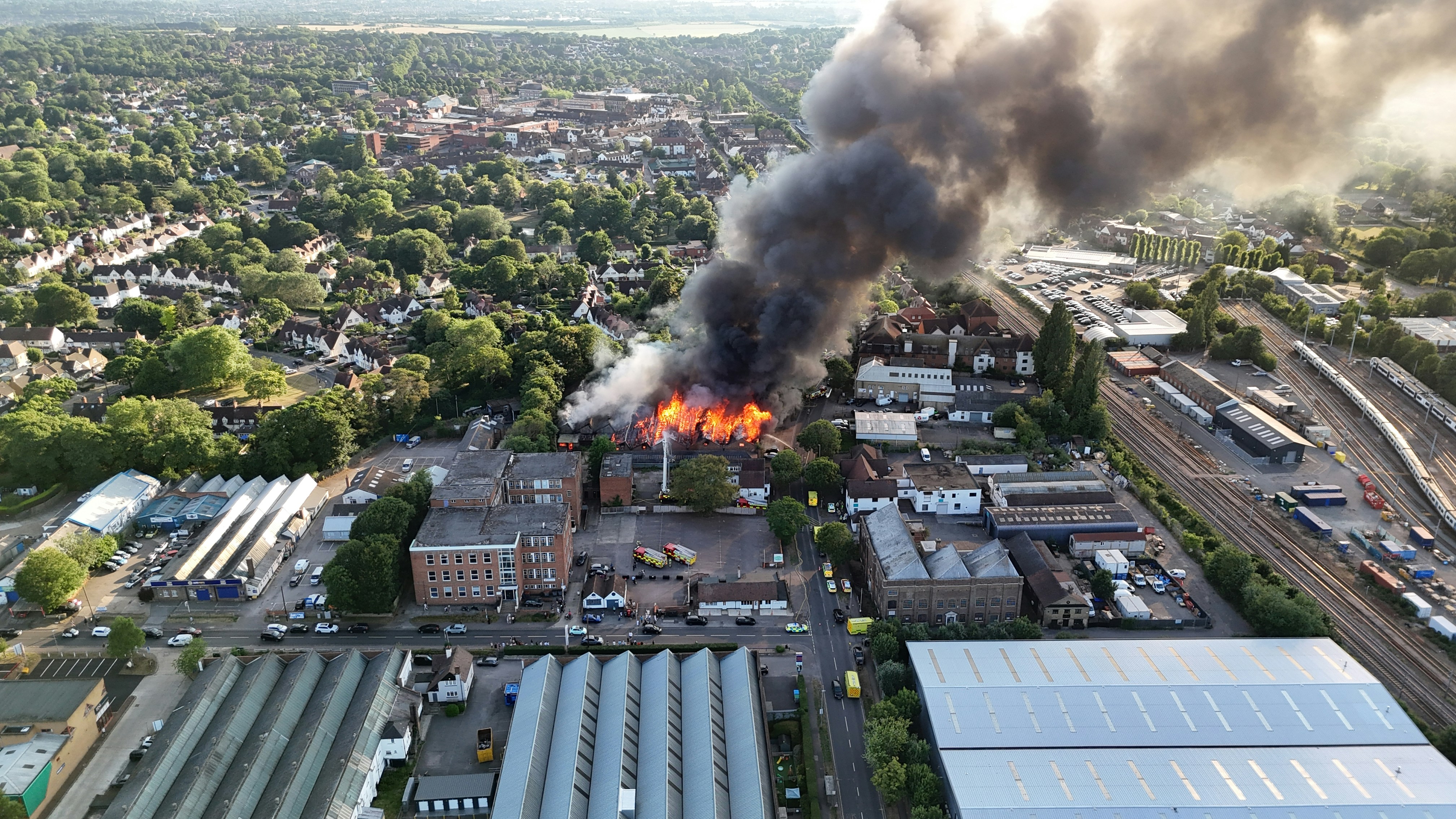 Conflagration Over the Rails: A Bird’s-Eye View of a City Blaze