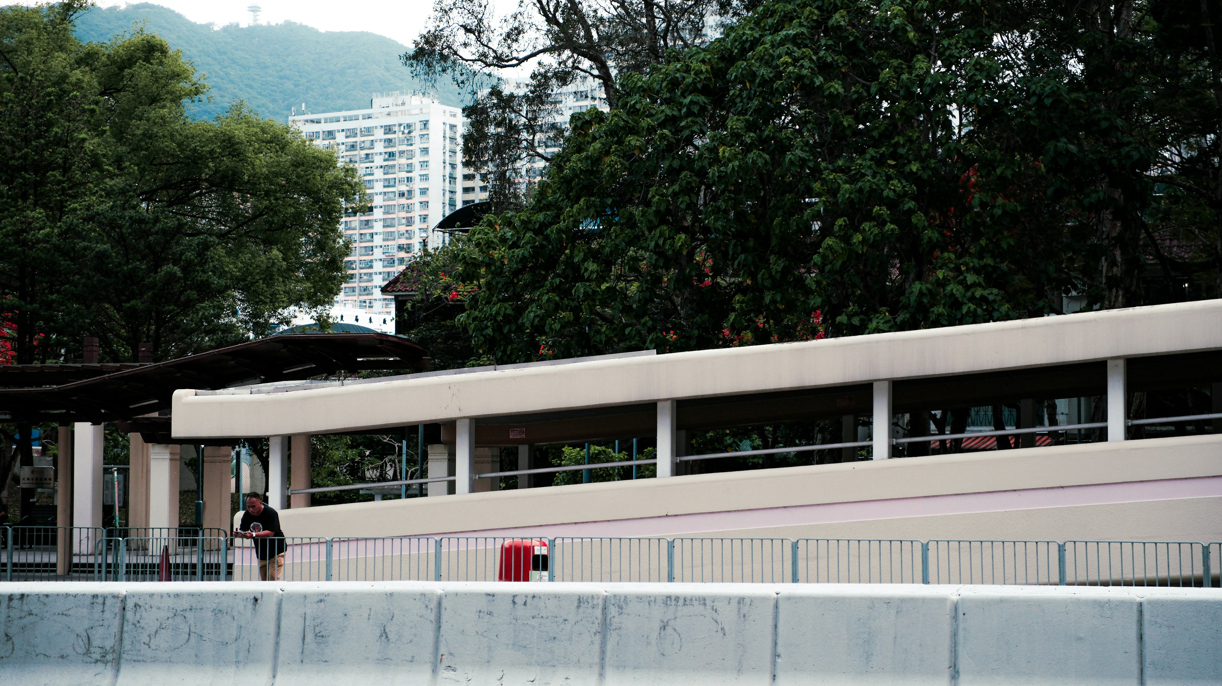 Person walking on a pedestrian walkway in the city.