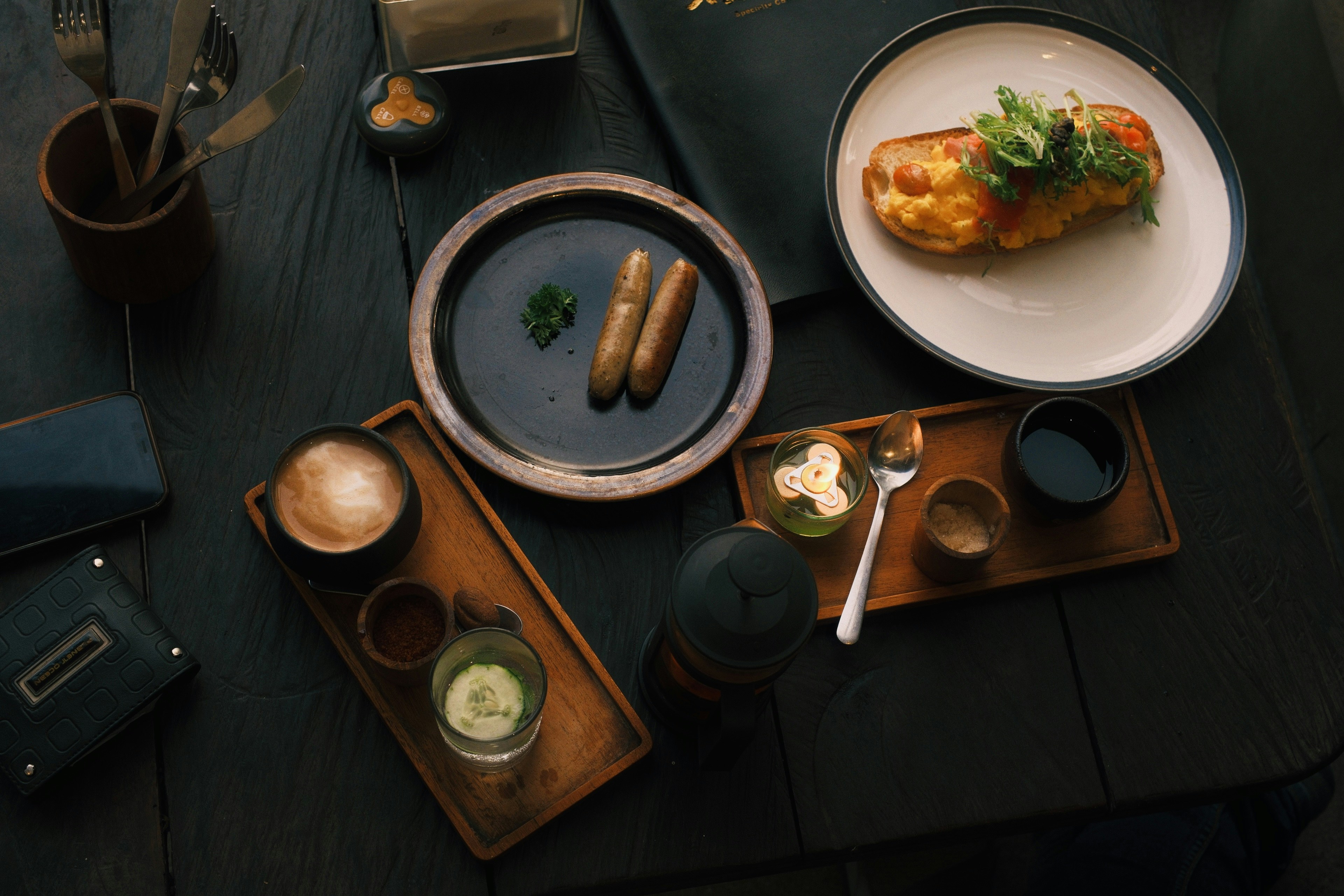 Breakfast is served with coffee and sausage.