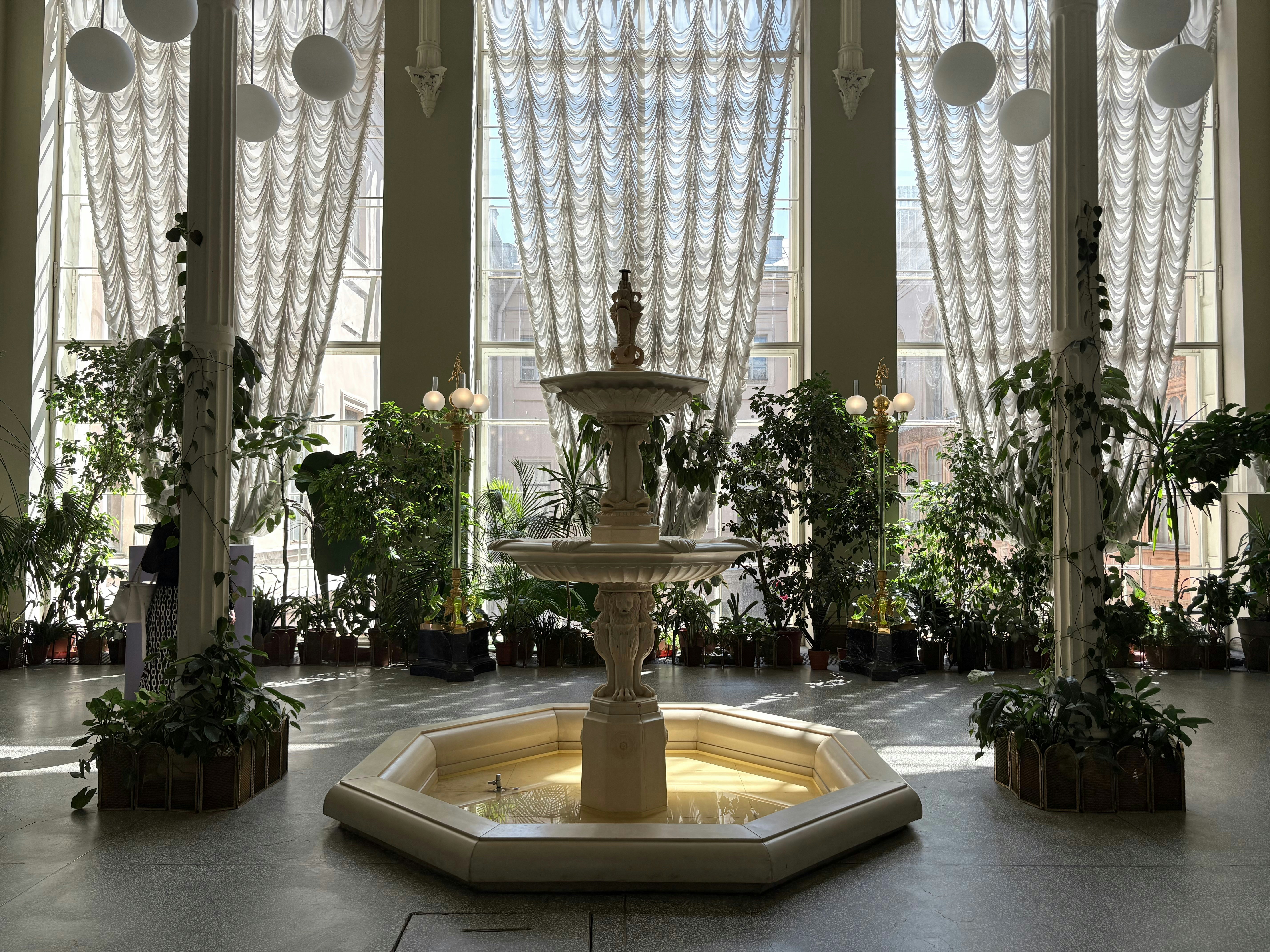 Serenity in Green: A Fountain's Embrace