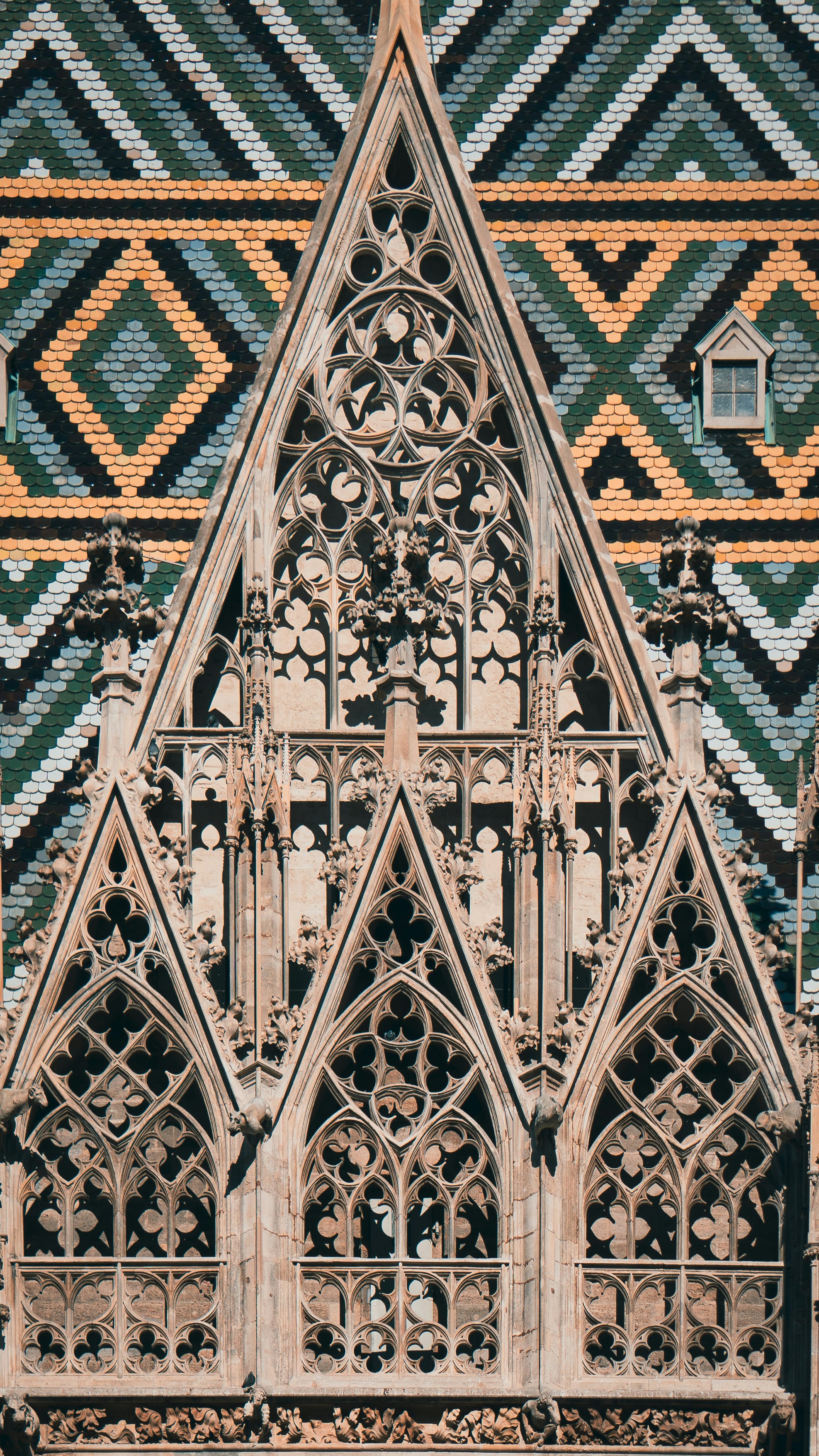 A gothic architectural detail with a tiled roof.