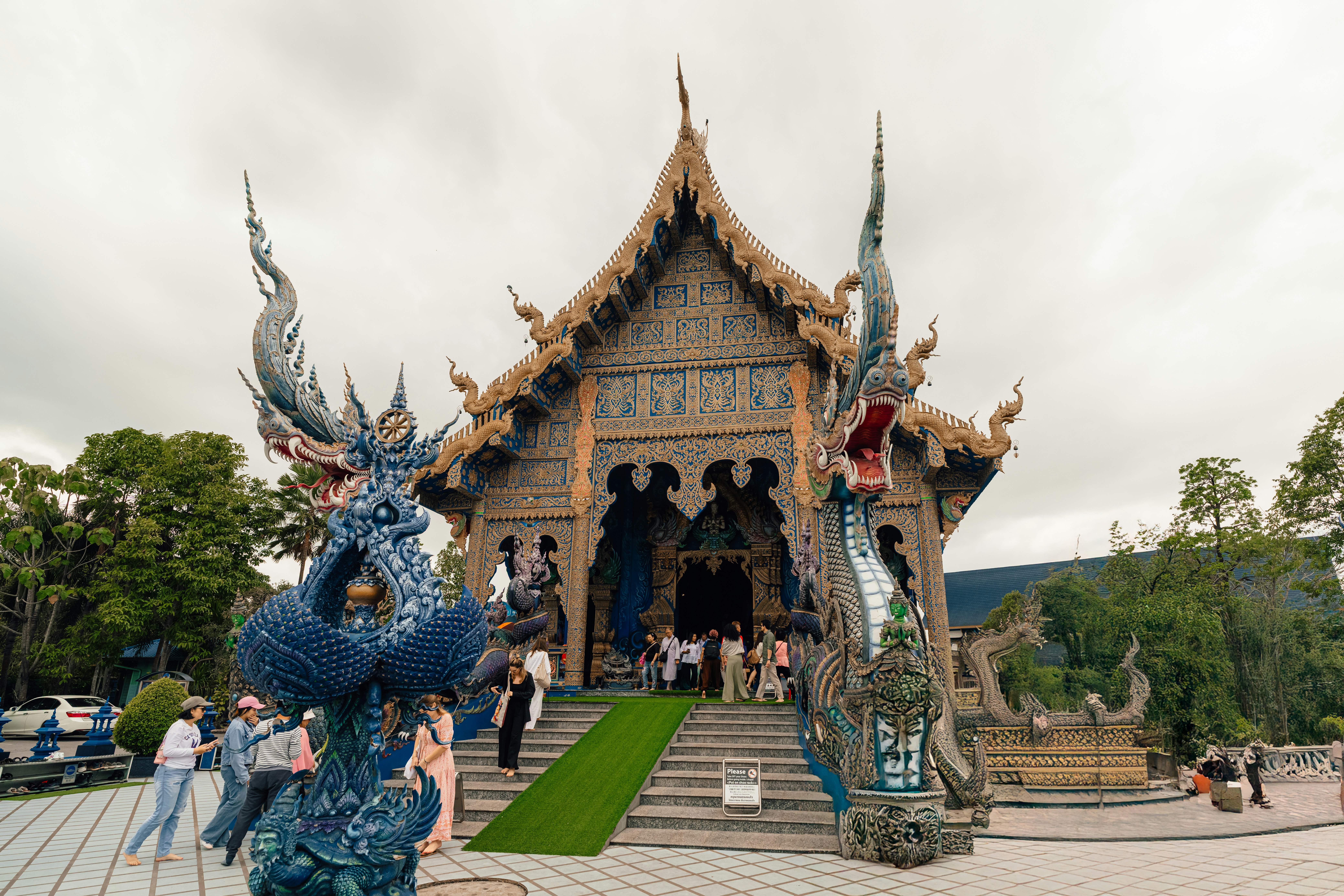 Dragon-Guarded Temple: Intricate Rooflines and a Lively Courtyard