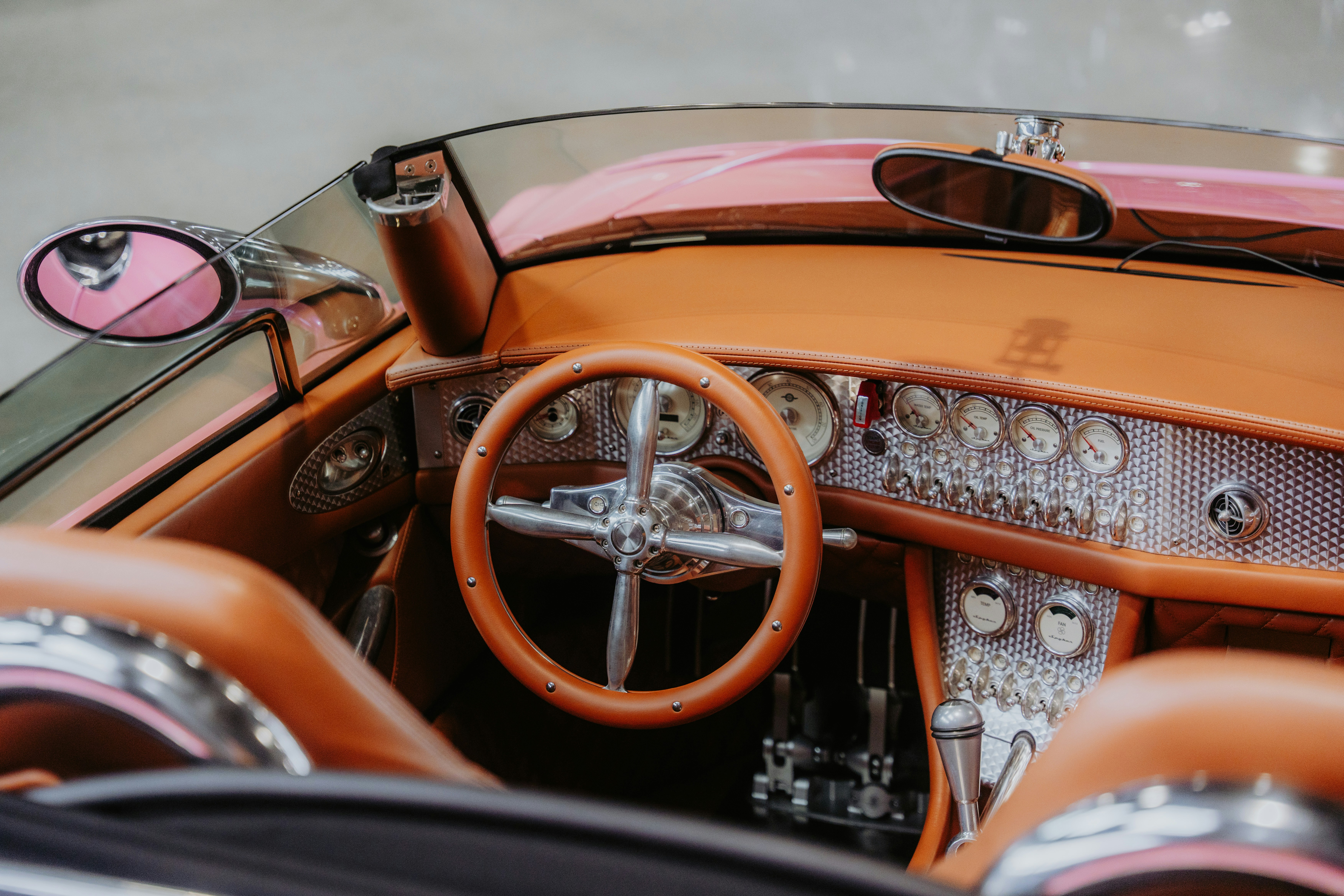 Orange Velvet Cockpit: Chrome Dial Symphony in a Vintage Convertible