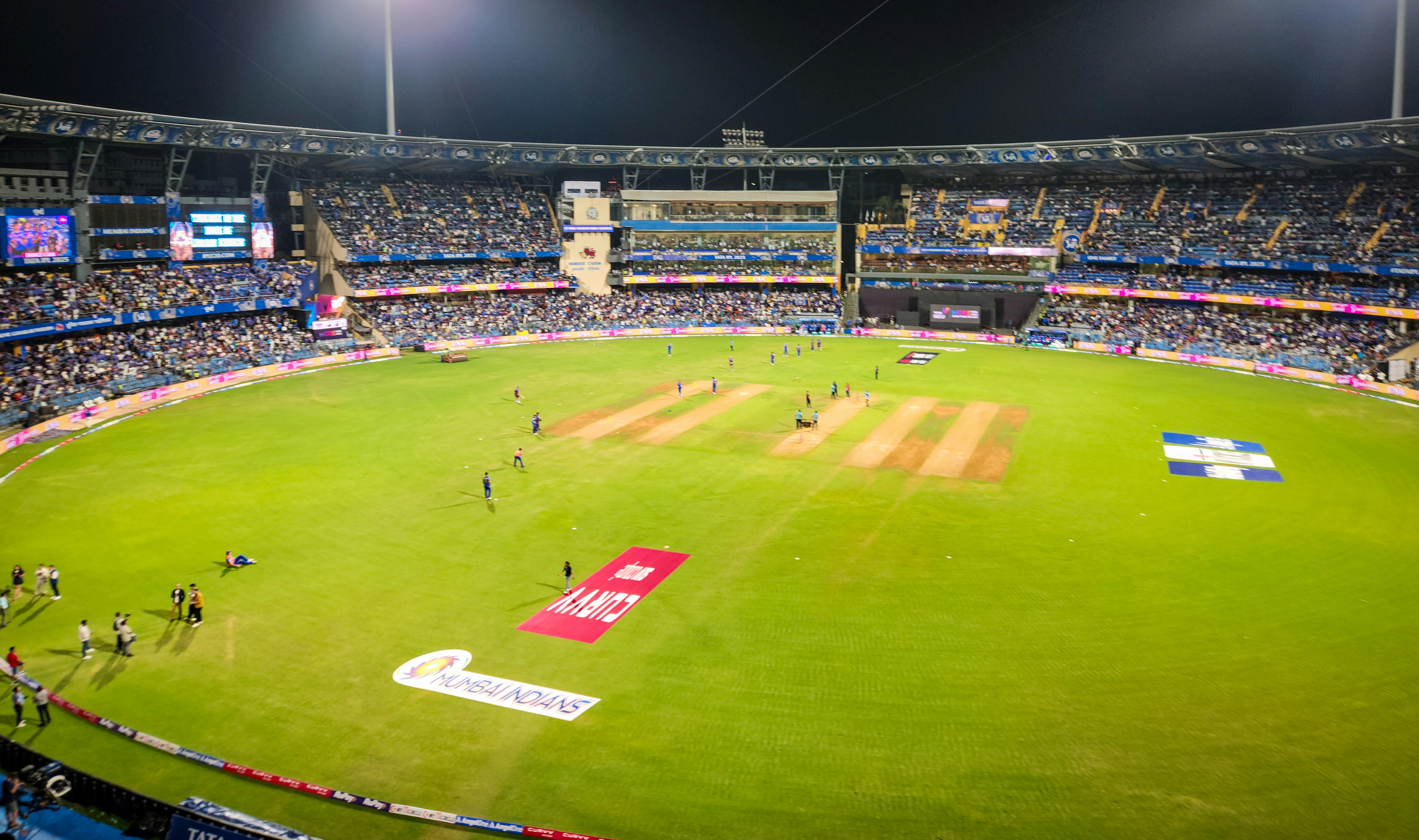 A cricket match is in progress at a stadium. photo – Free India Image ...