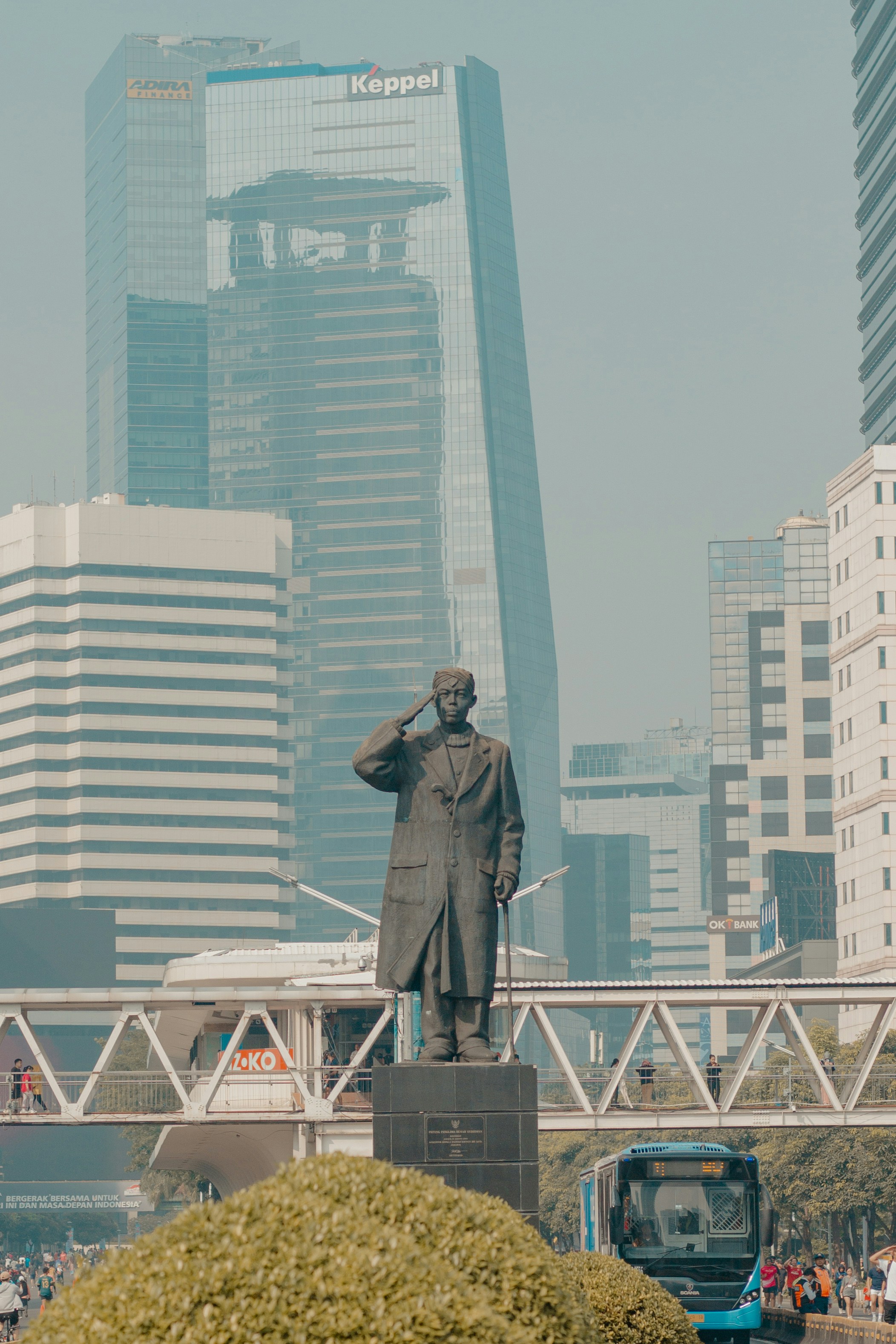 A Salute to Progress: The Iconic Figure Amidst Urban Splendor